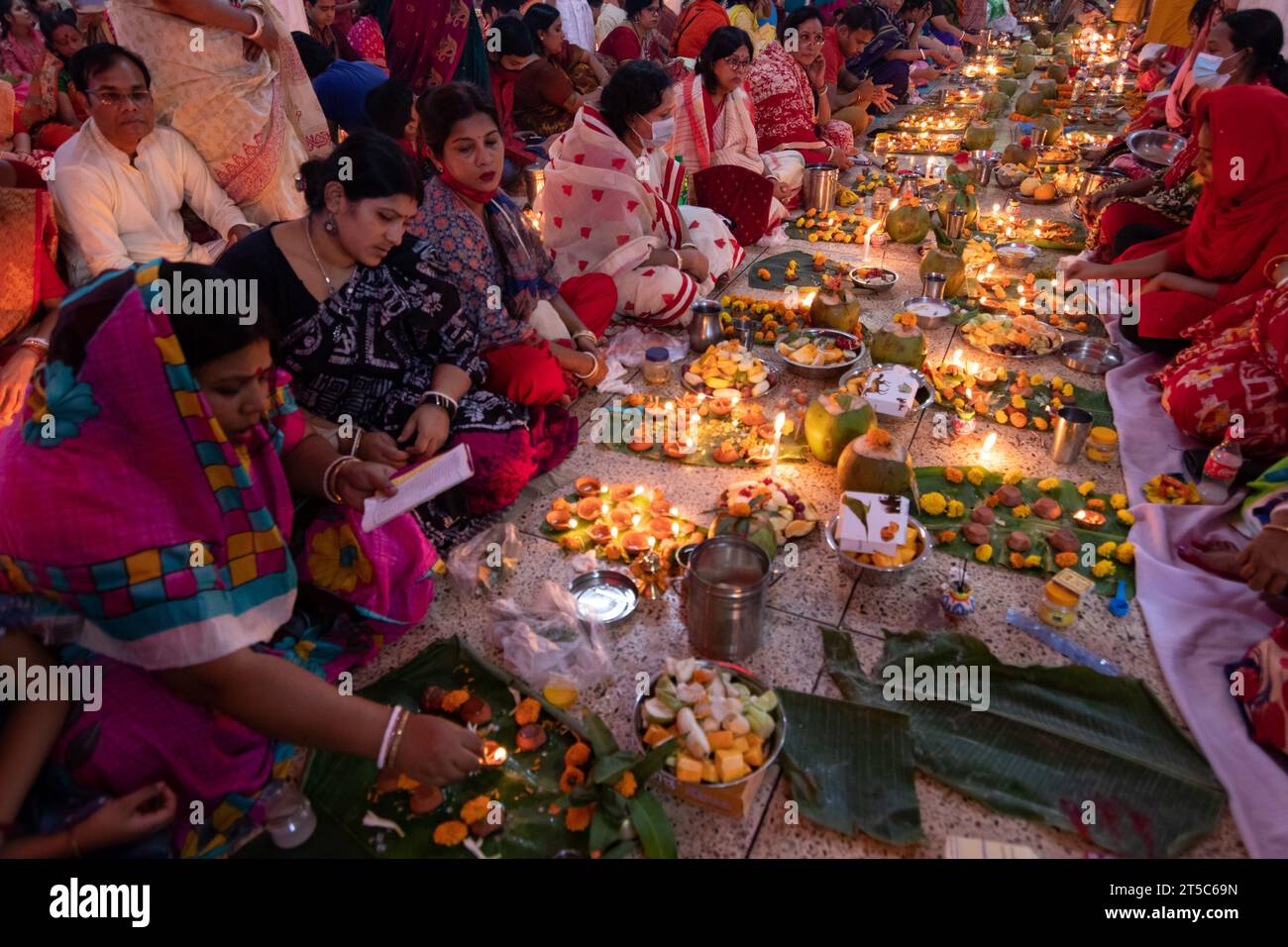 Dhaka, Bangladesh. 4th Nov, 2023. Hindu devotees sit with Prodip ...