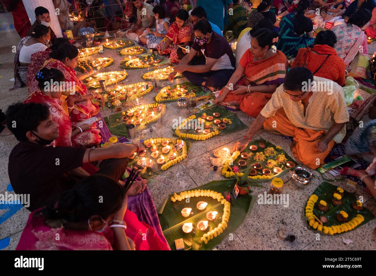Dhaka, Bangladesh. 4th Nov, 2023. Hindu devotees sit with Prodip ...