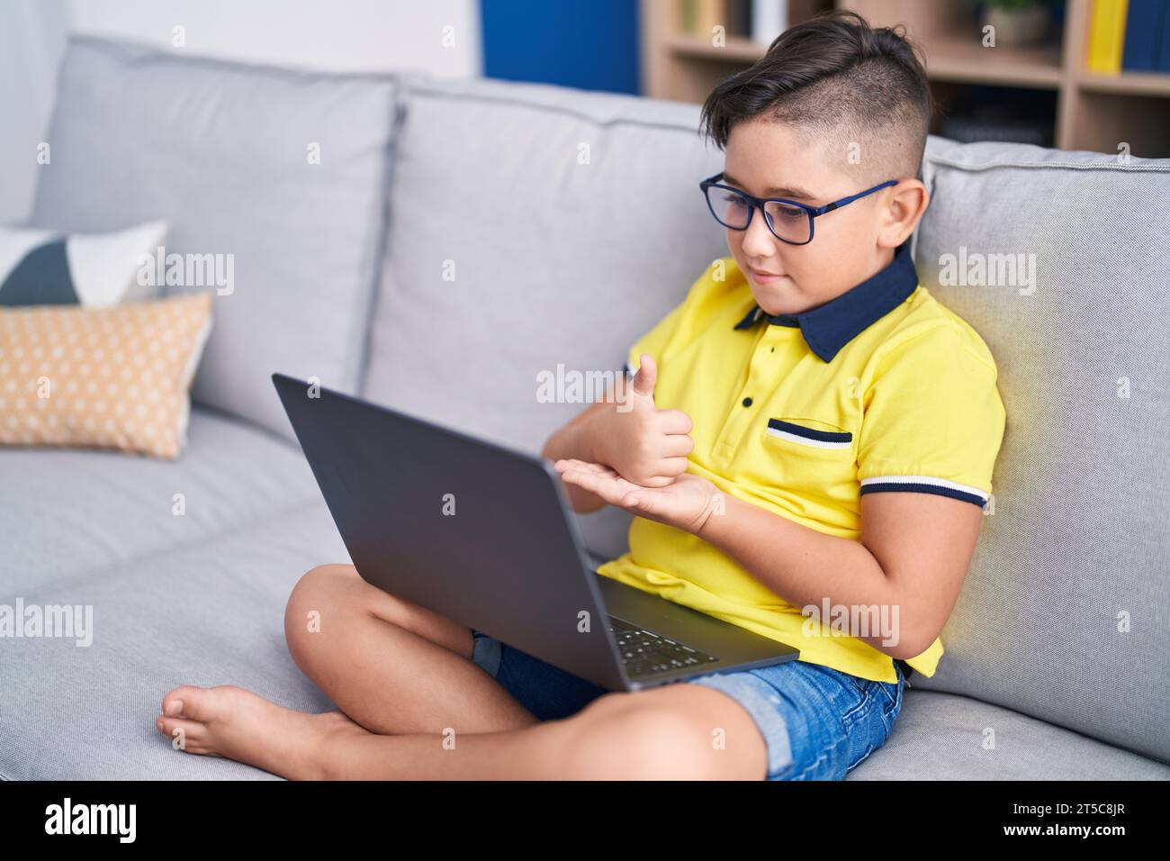 Adorable hispanic boy having video call communicate with sign deaf ...