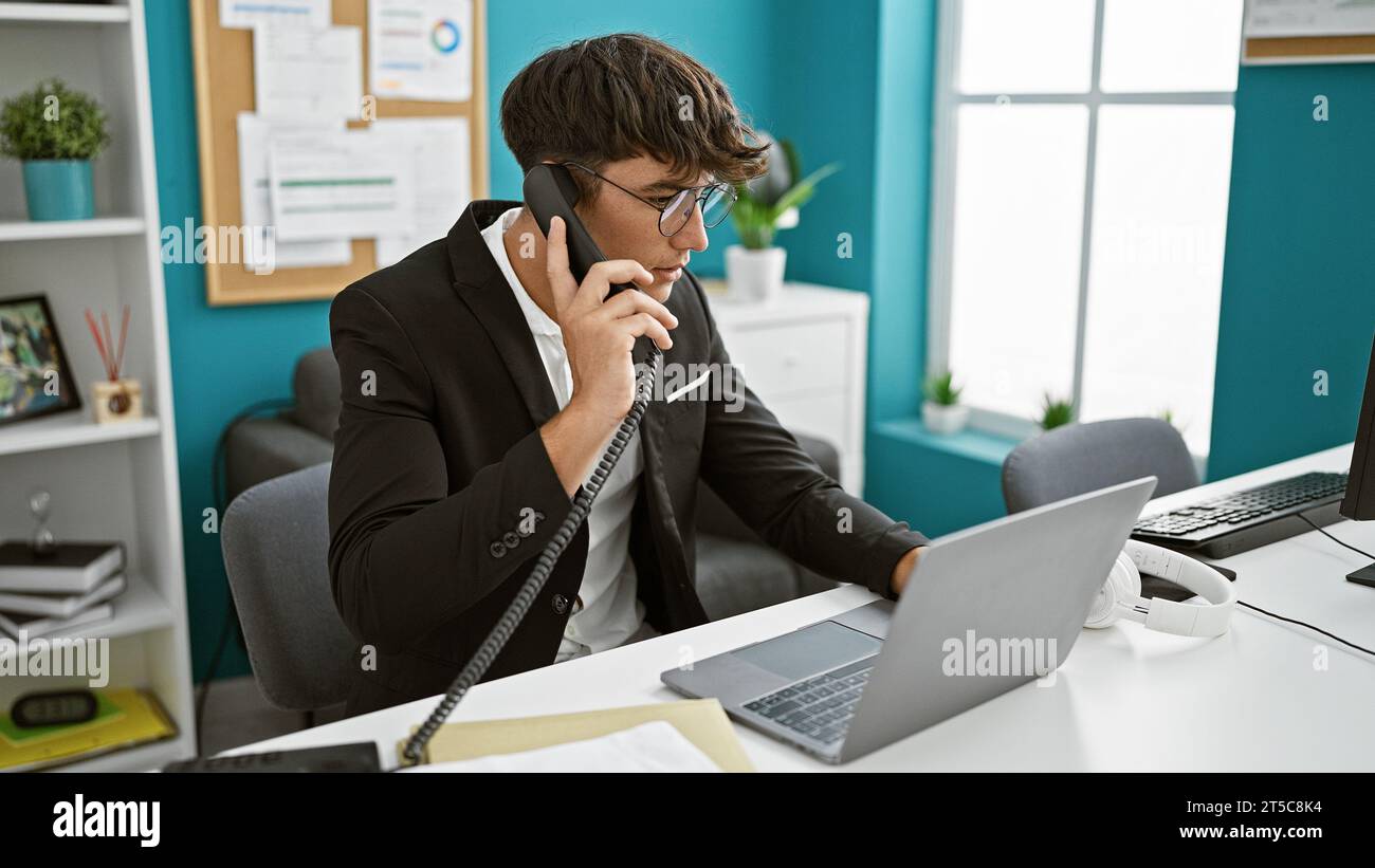 Engrossed young hispanic business prodigy, teenager worker holding ...