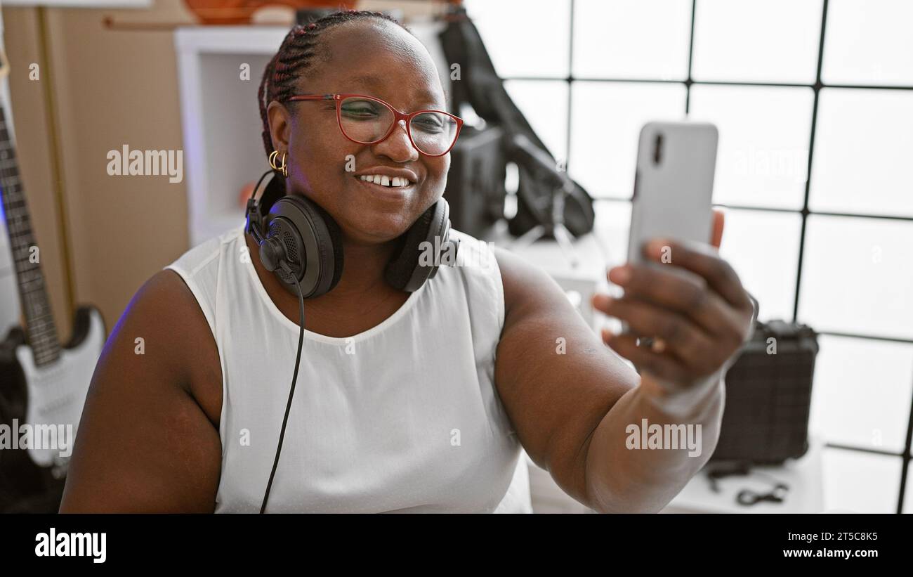 Vibrant african american woman reporter hosting a live podcast from ...