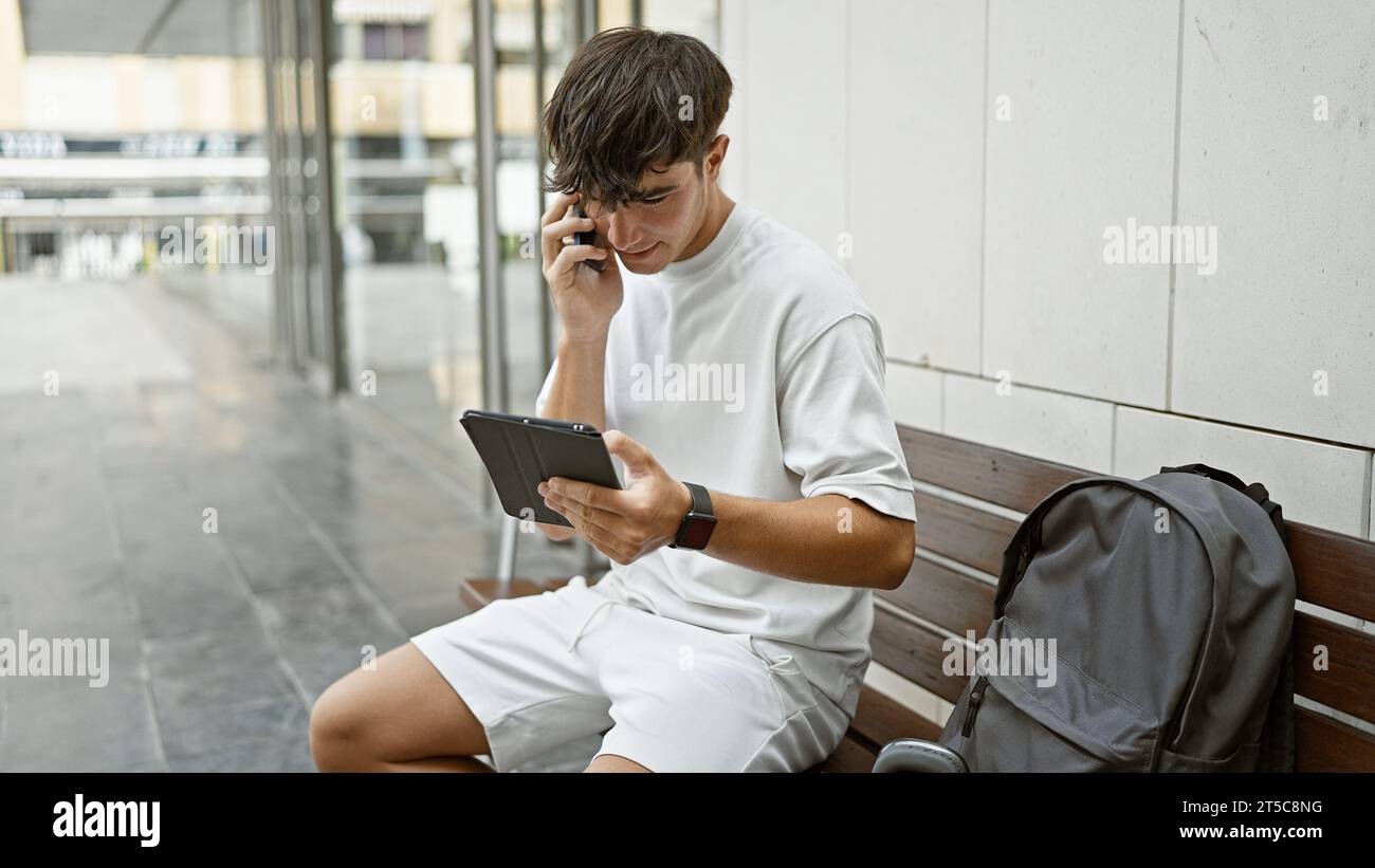 Smart young hispanic teenager, a university student, deeply engrossed ...