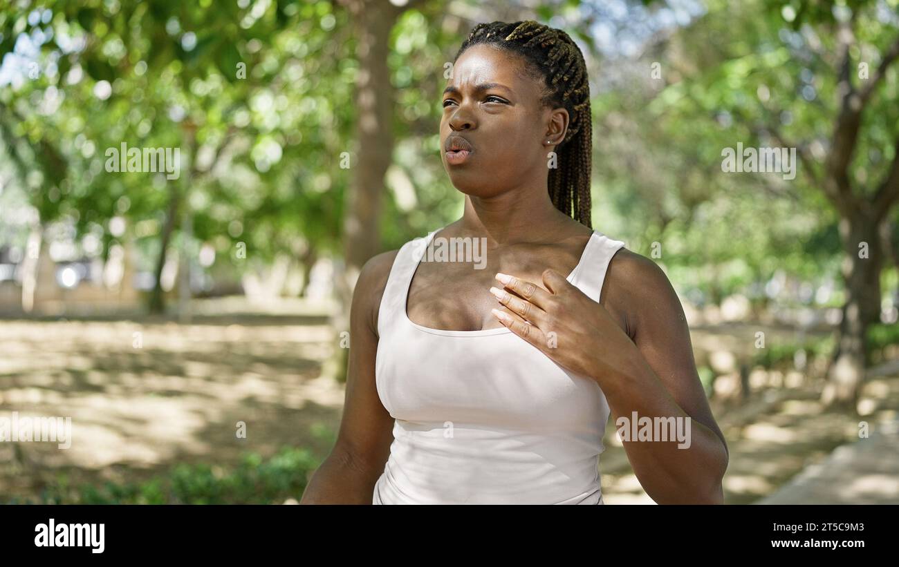 African american woman sweating at park Stock Photo - Alamy