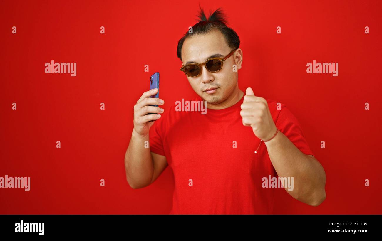 Groovy tech! cool, young chinese guy seriously lost in the rhythm ...