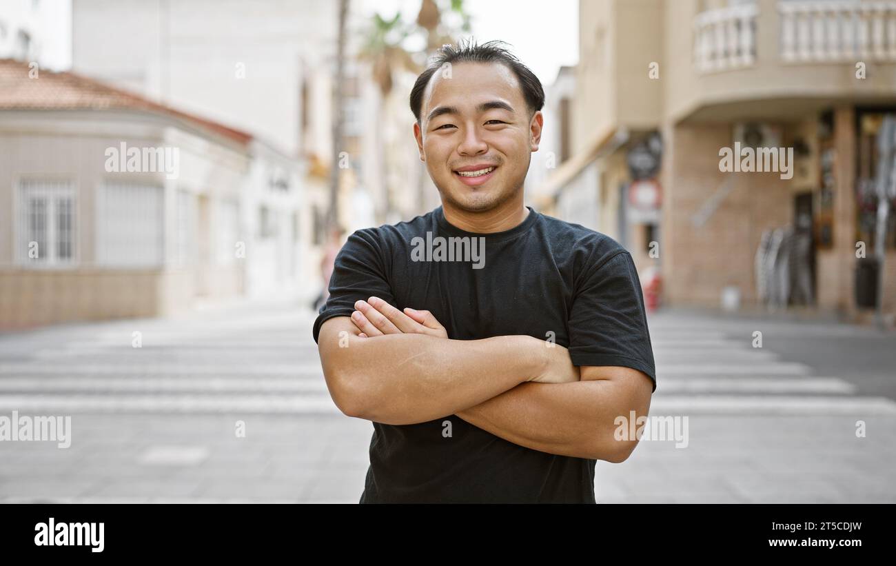 Handsome chinese man radiating confidence hi-res stock photography and ...