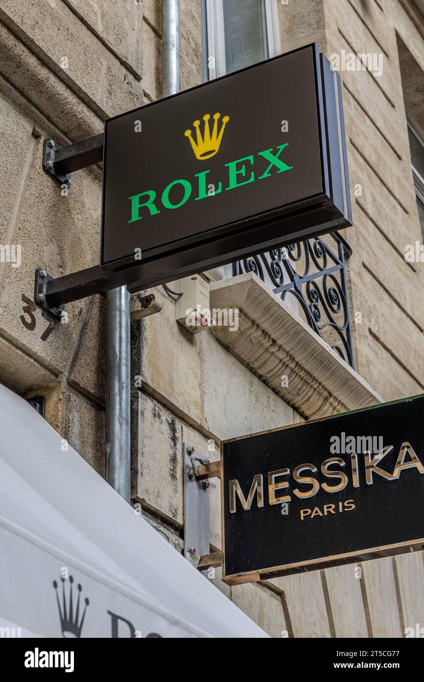 Rolex and Messika brand signs in a street of Bordeaux, Gironde, France ...