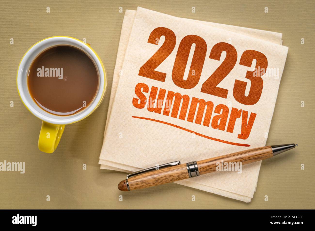 2023 year summary text on a napkin with a cup of coffee, end of year ...