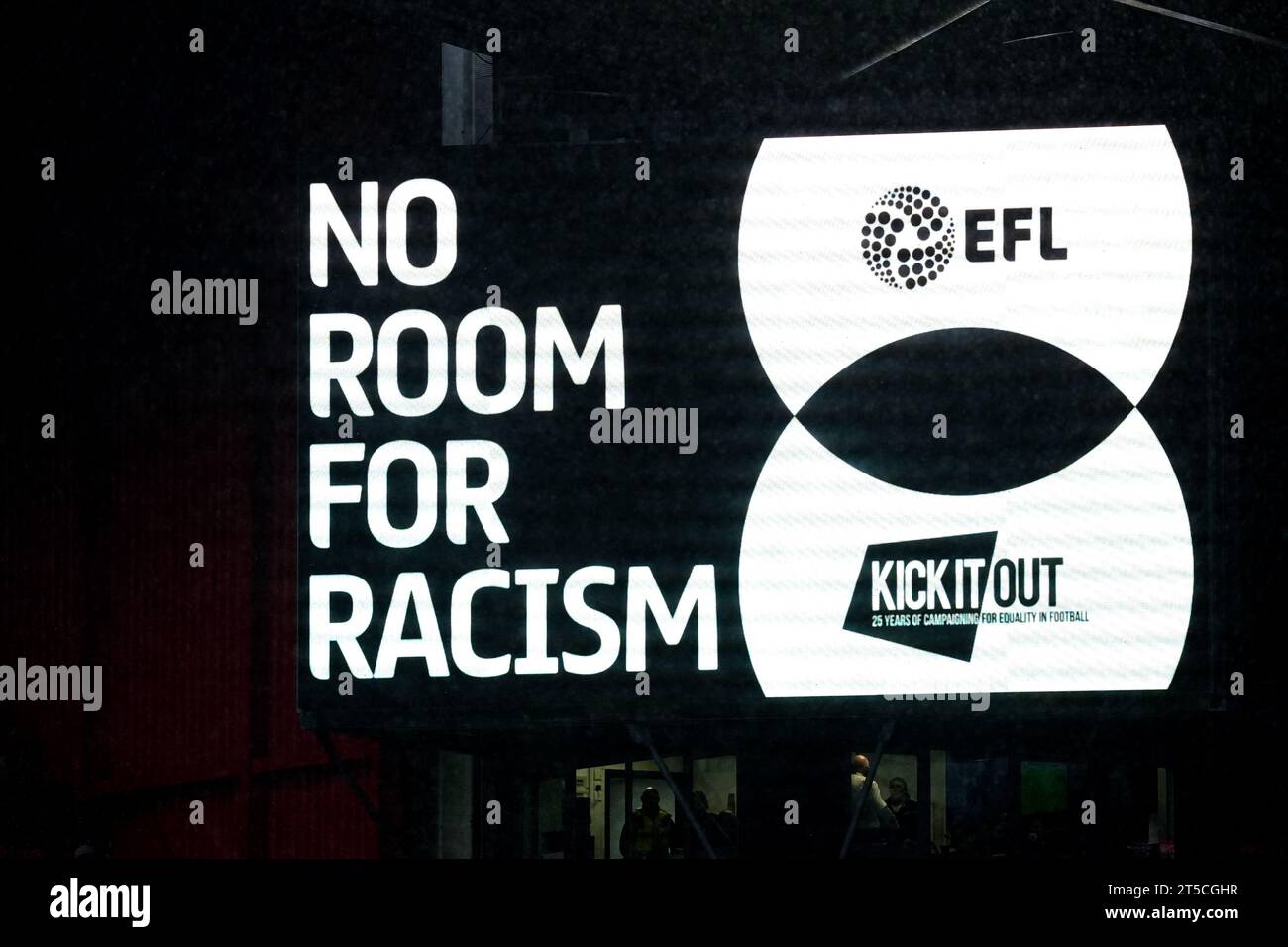 No Room for Racism signage is shown on the big screen during the ...