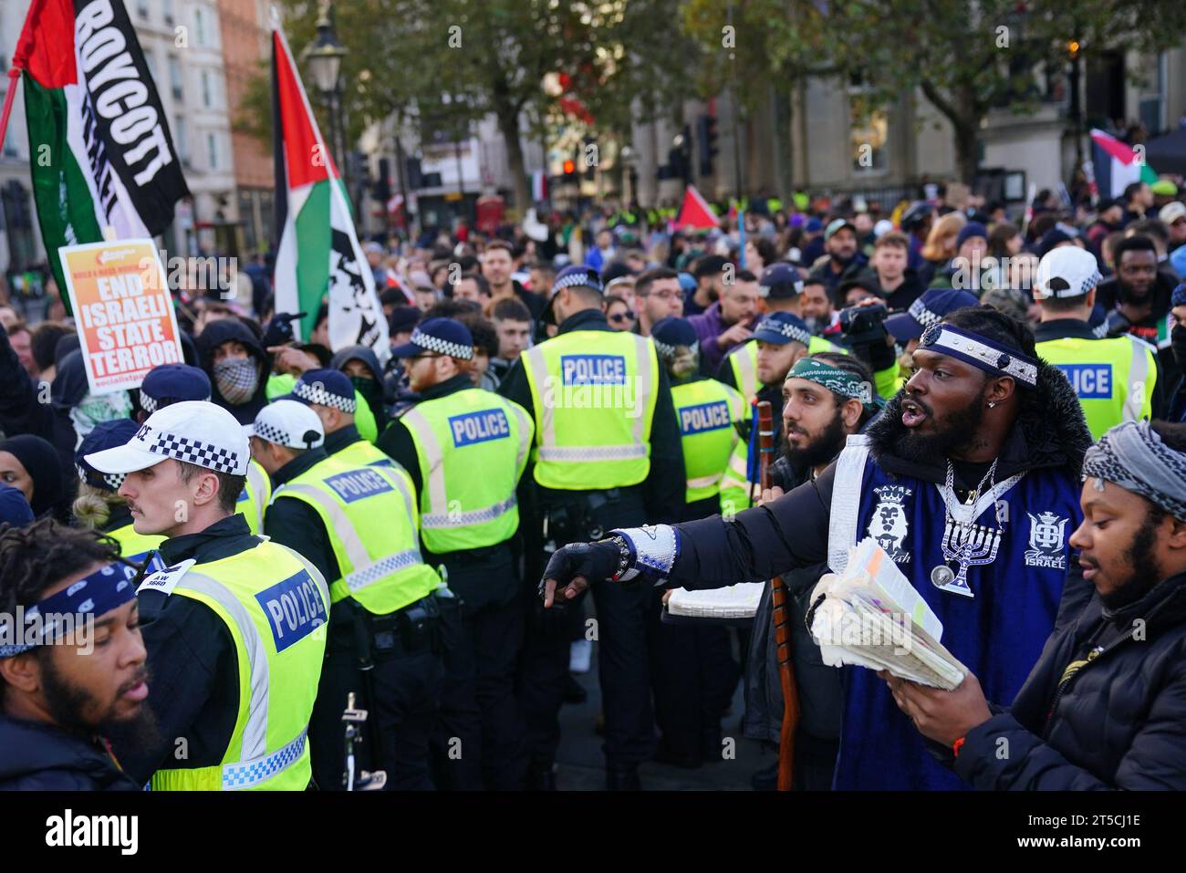 A police line separates members of the Black Hebrew Israelite Movement ...