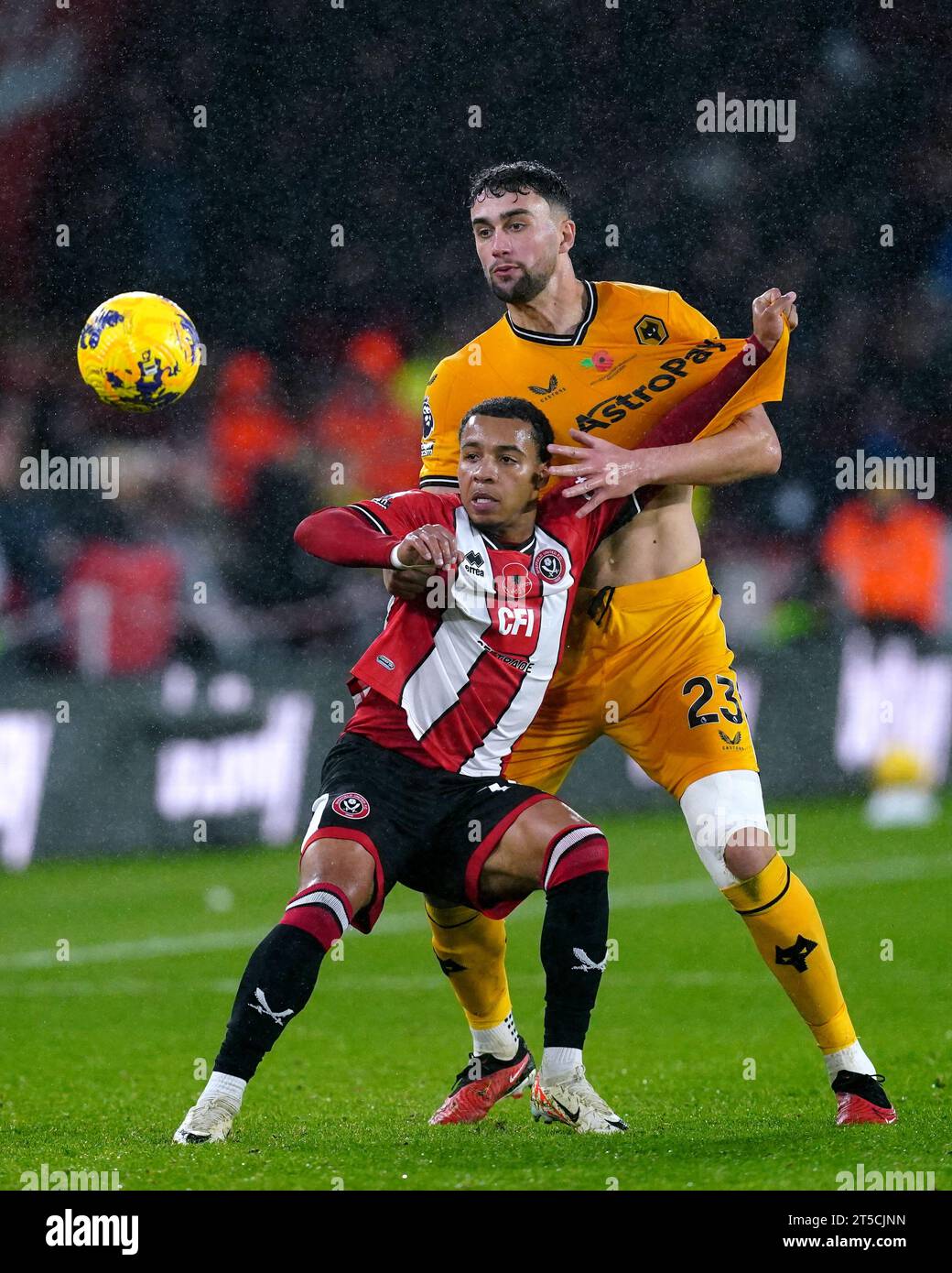 Sheffield United's Cameron Archer and Wolverhampton Wanderers' Max Kilman battle for the ball ...
