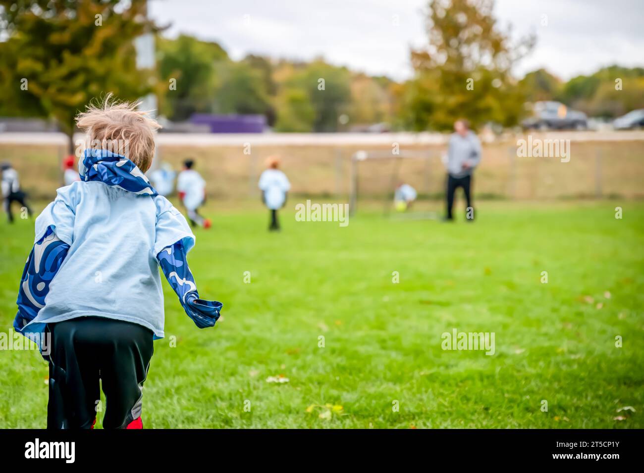 Child on the sidelines cheering on his soccer team Stock Photo - Alamy