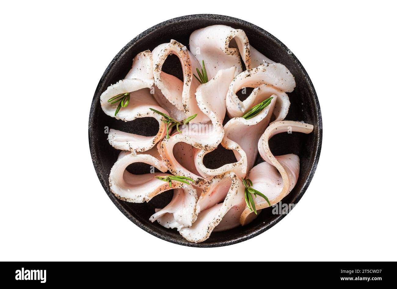 Fresh sliced lard with salt, garlic and pepper in pan with herbs ...