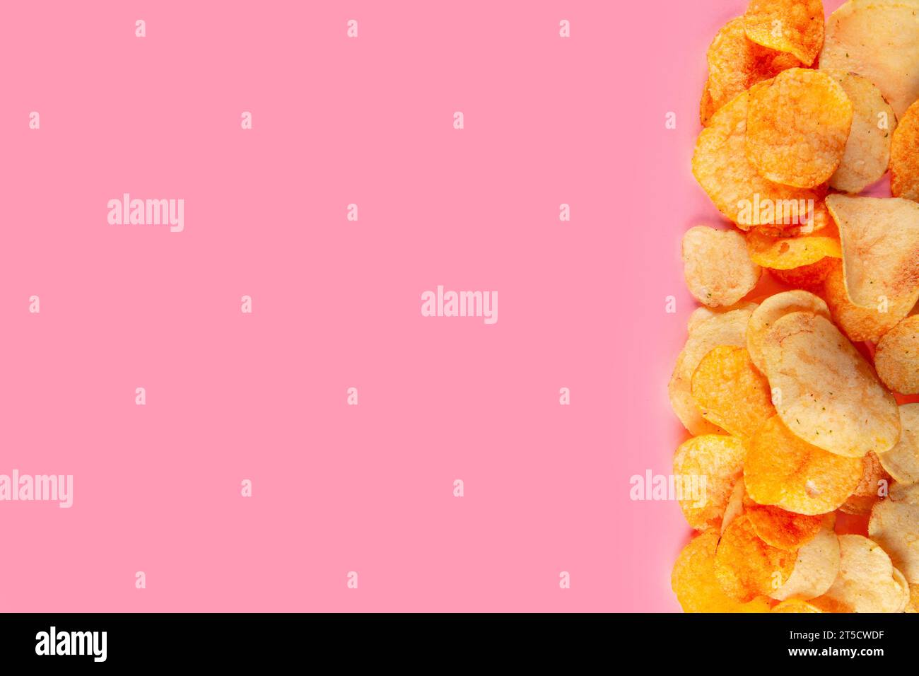 Border of potato chips isolated on pink background. Snackable bite-size ...