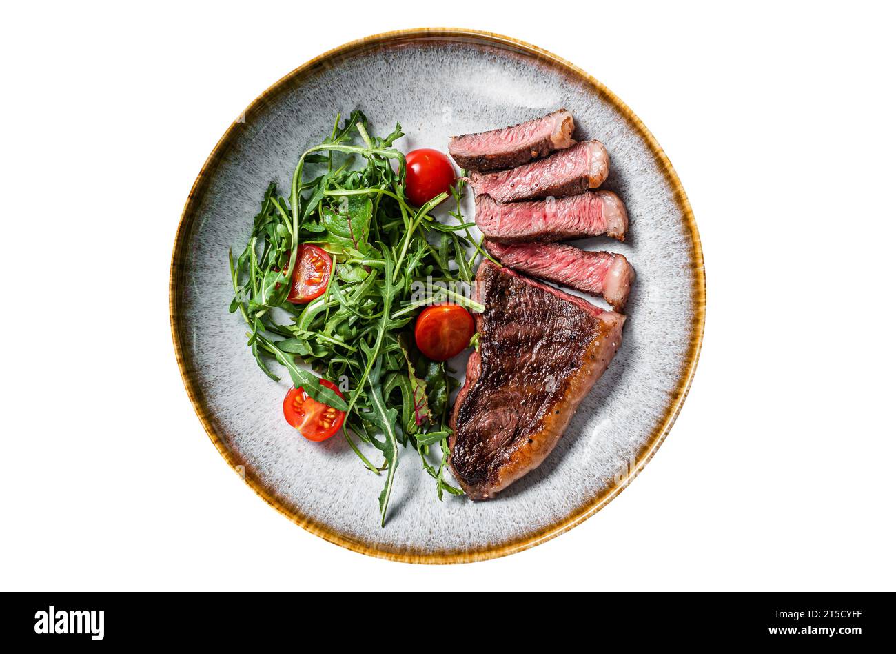 Grilled Top sirloin beef meat steak in plate with vegetable salad ...