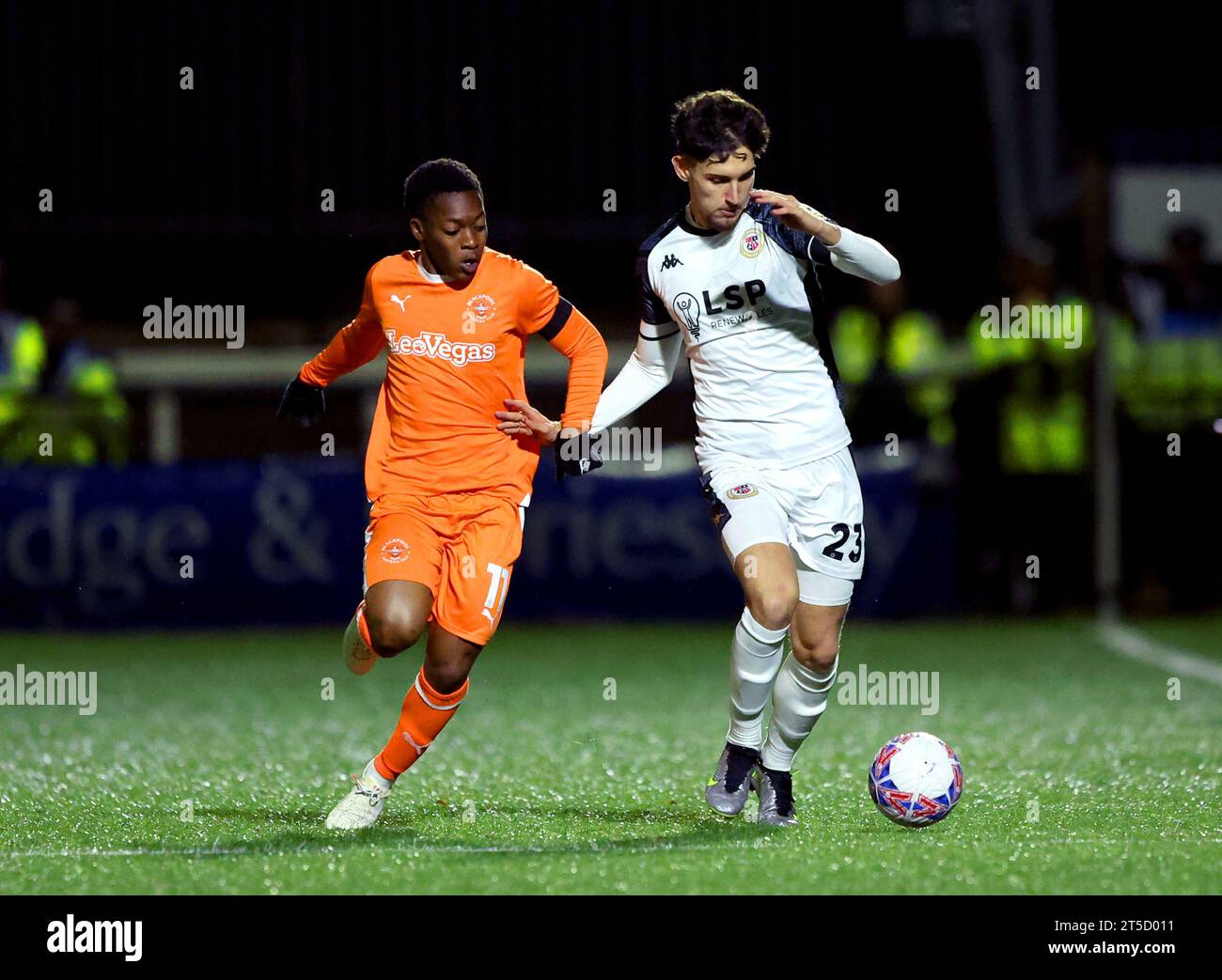 Blackpool's Karamoko Dembele (left) and Bromley's Besart Topalloj ...