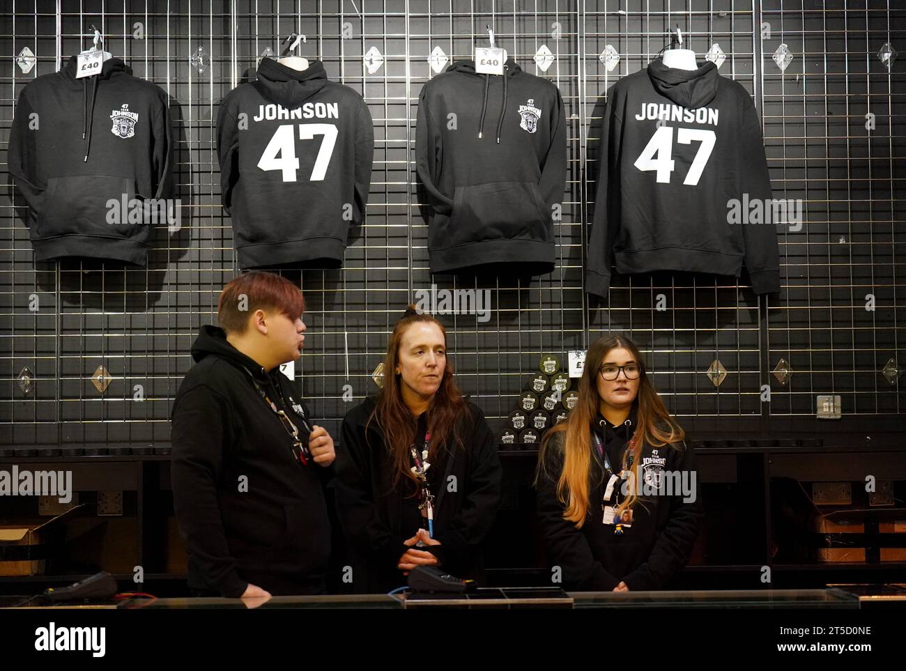 A merchandise stand selling memorial jerseys as people attend a ...