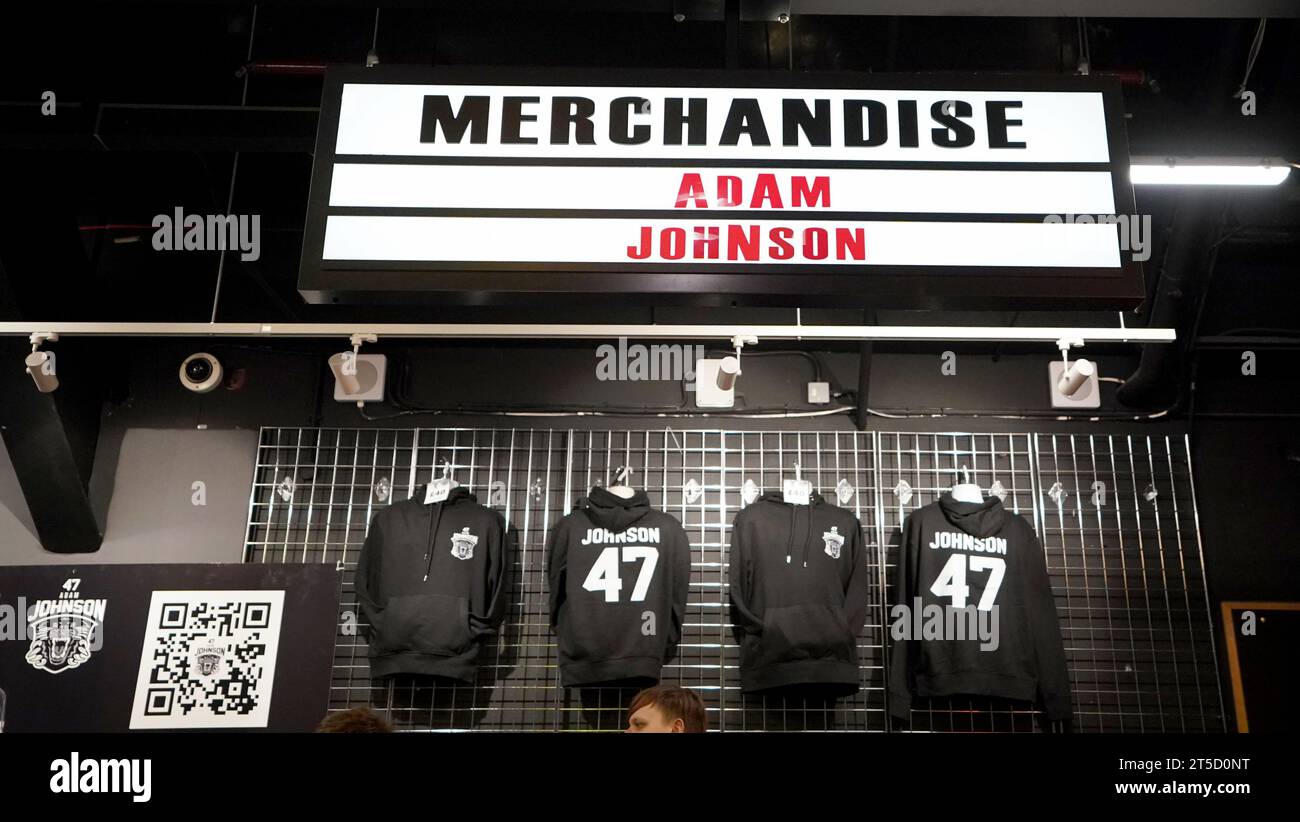 A merchandise stand selling memorial jerseys as people attend a ...