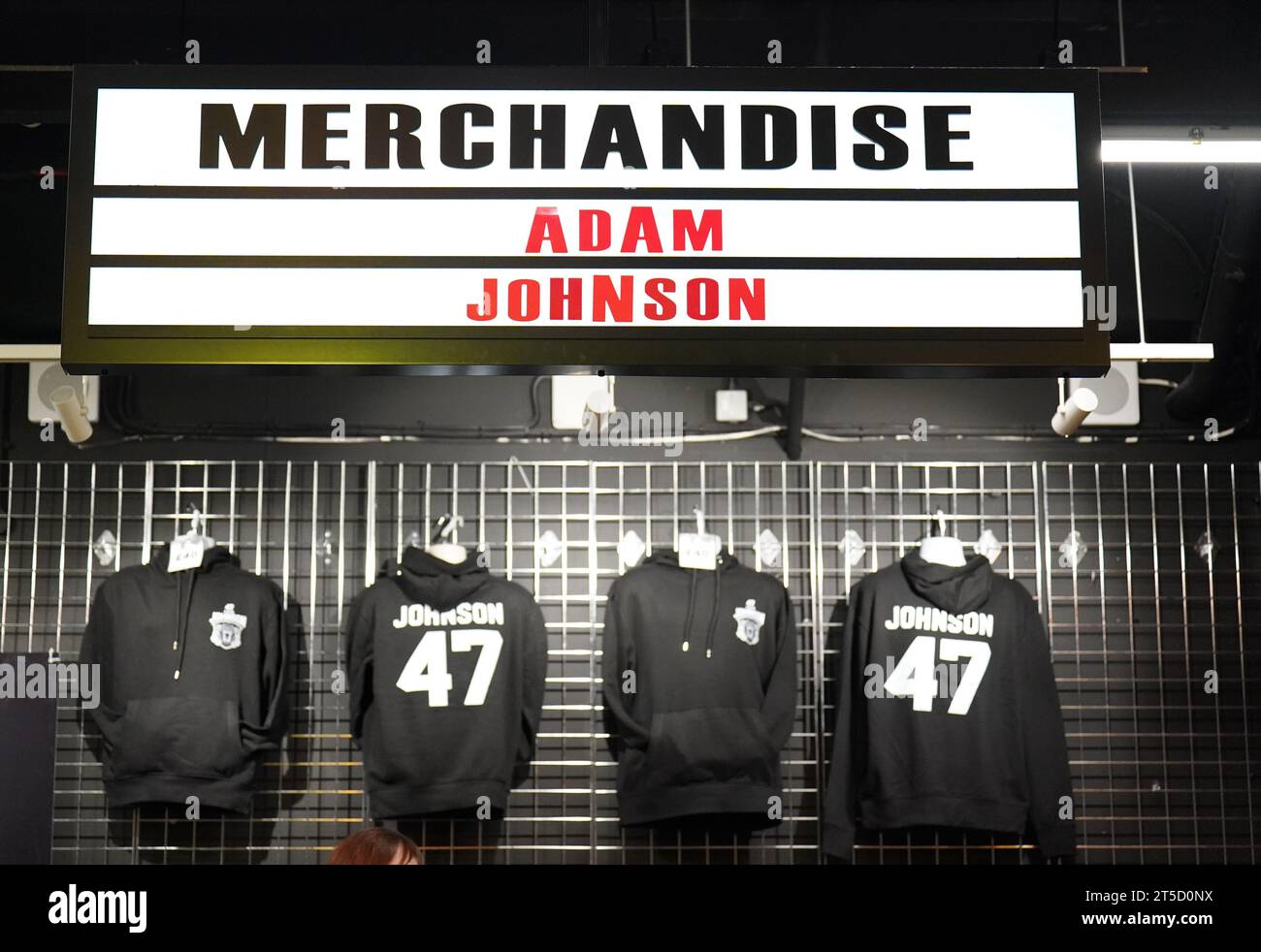 A merchandise stand selling memorial jerseys as people attend a ...