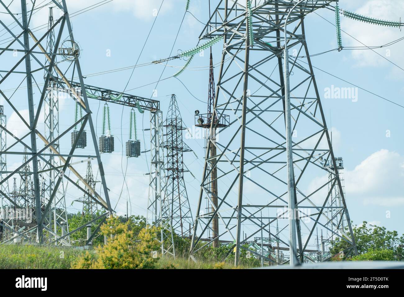 High voltage towers with sky background. Power line support with wires ...