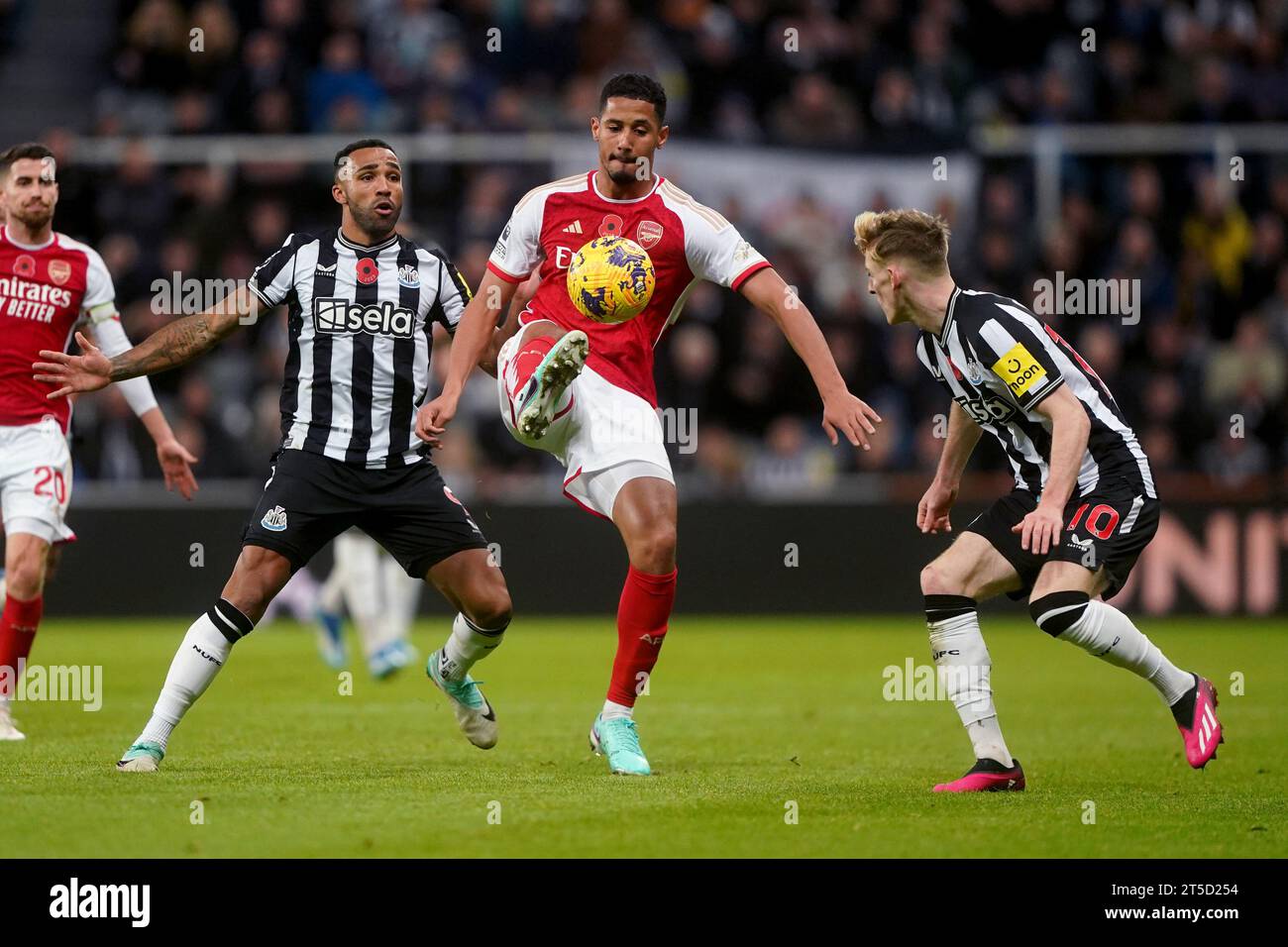 Newcastle United's Callum Wilson (left) and Arsenal's William Saliba ...