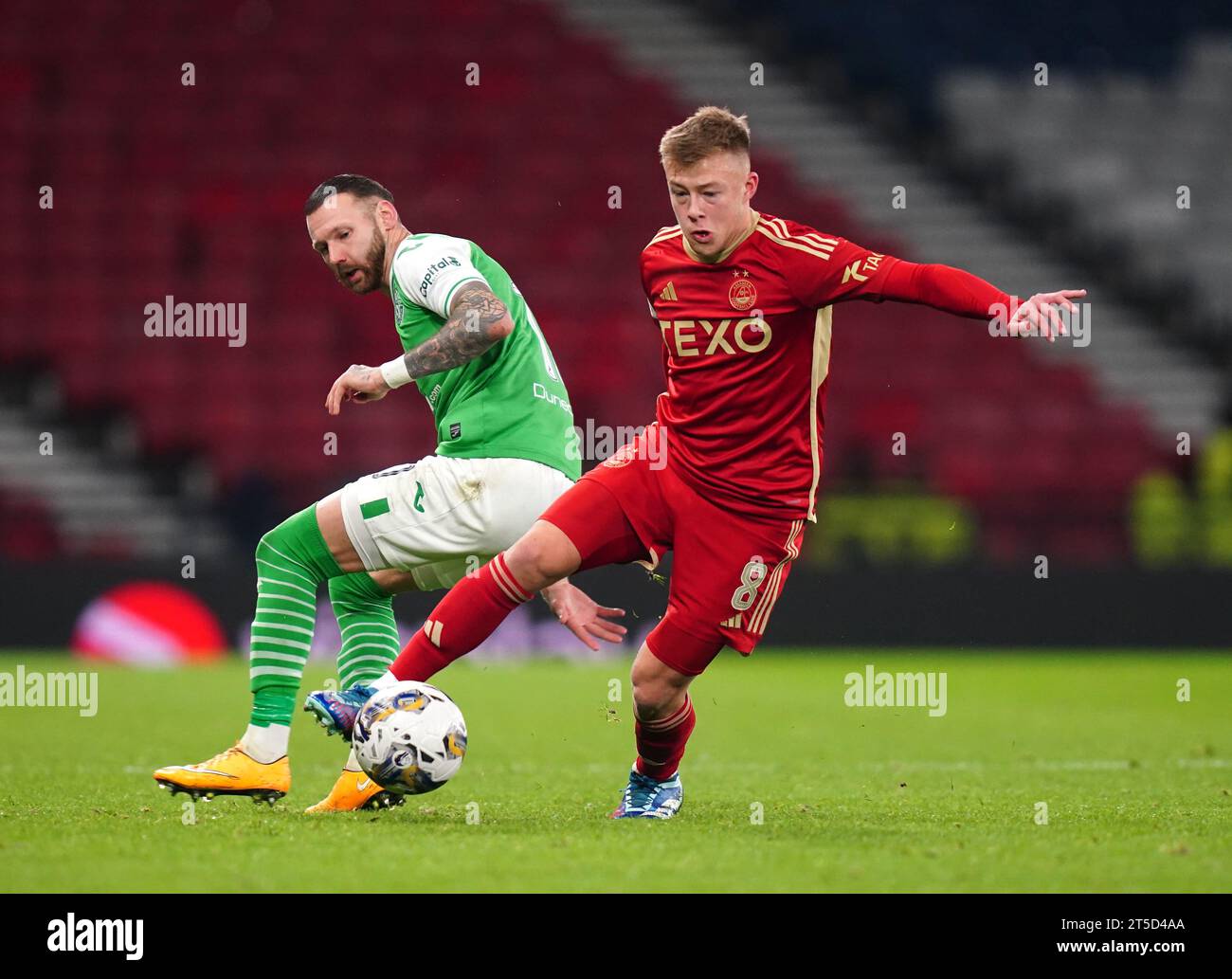 Hibernian's Martin Boyle (left) and Aberdeen's Connor Barron battle for the ball during the ...
