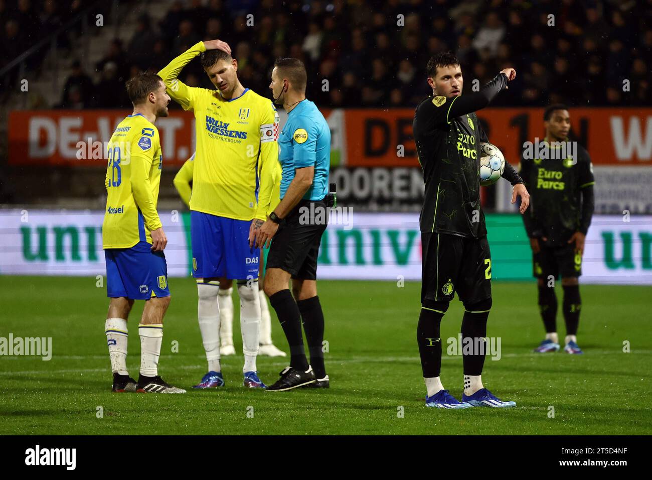 WAALWIJK - (l-r) Aaron Meijers of RKC Waalwijk, Michiel Kramer of RKC Waalwijk, referee Pol van ...