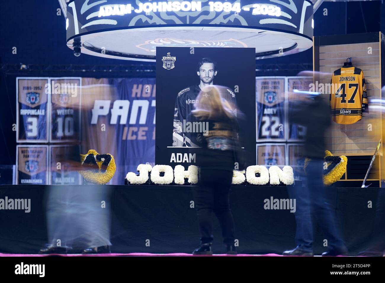 People queue to sign a book of condolence as they attend a memorial for ...