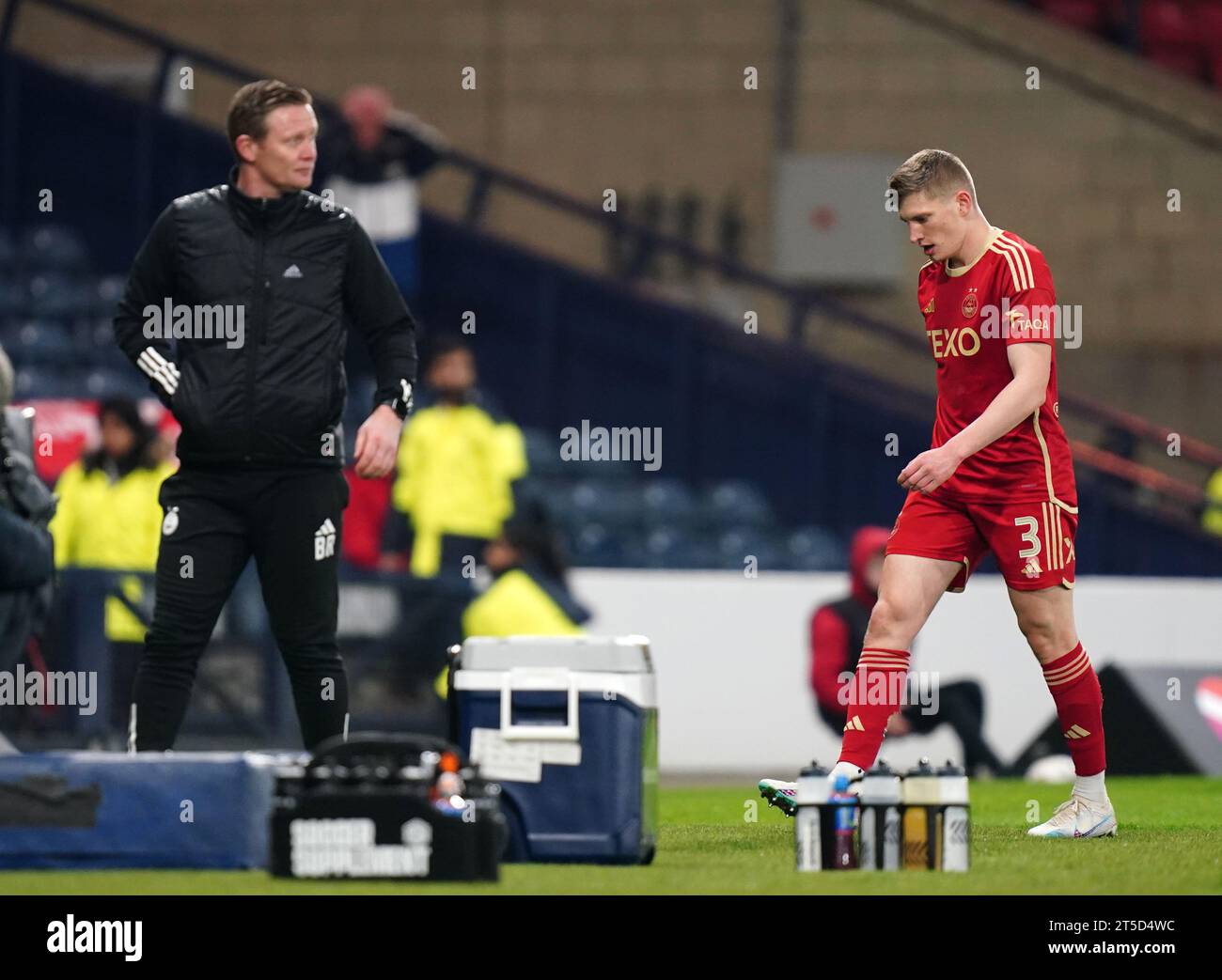 Aberdeen's Jack Mackenzie leaves the pitch after being given a red card ...