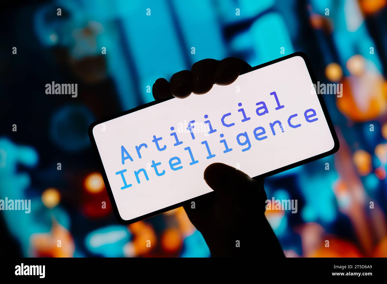 In this photo illustration, the Artificial Intelligence text is displayed on a smartphone screen ...