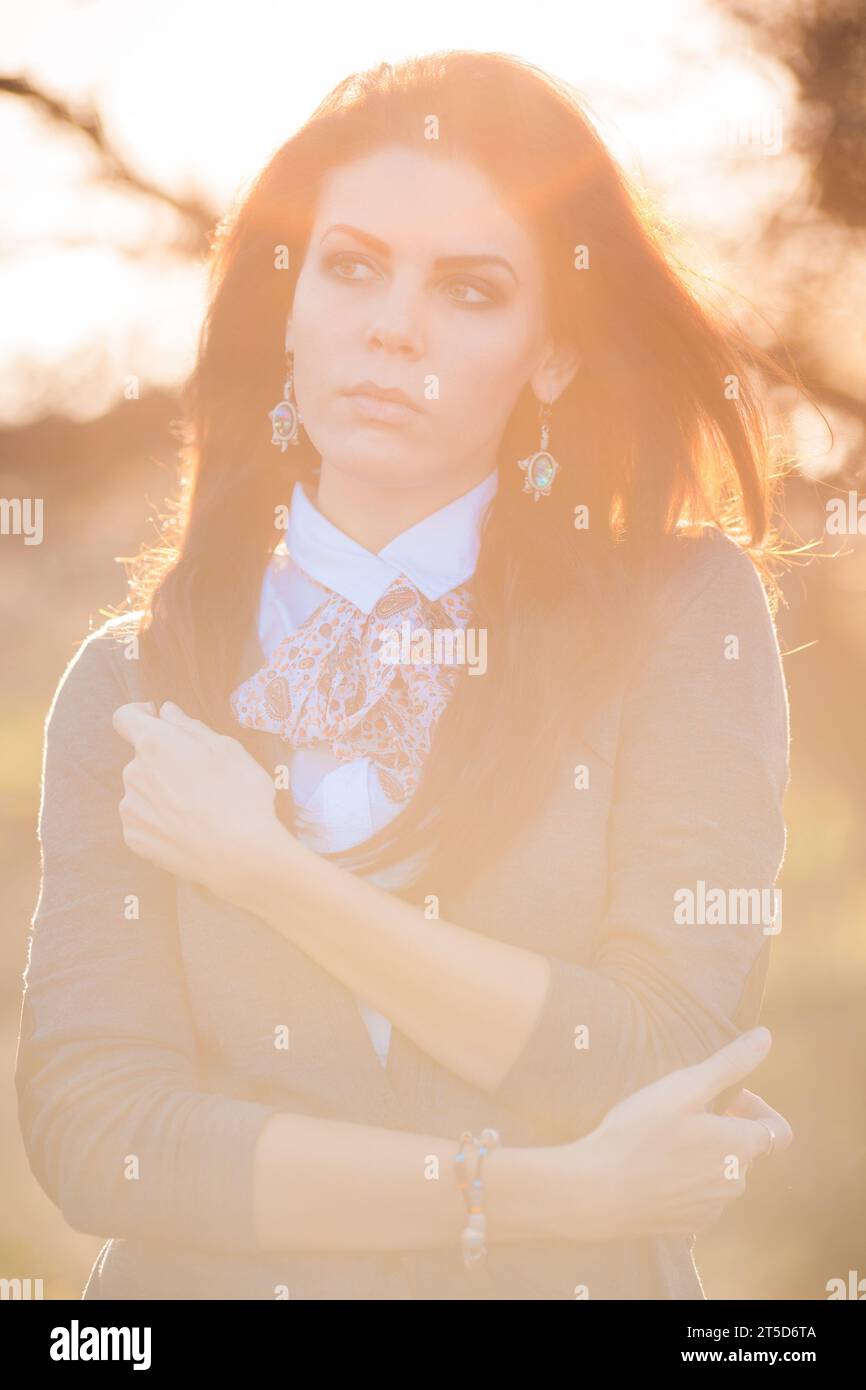 A captivating portrait of a brunette woman amidst the enchanting beauty ...