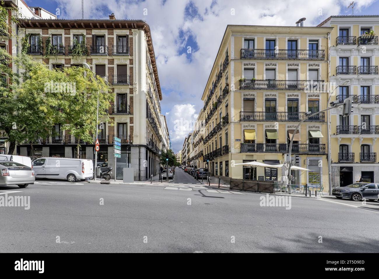 Facades of old urban residential housing on a ramp street Stock Photo ...