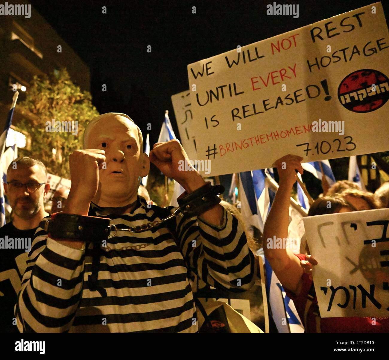 Jerusalem, Israel. 04th Nov, 2023. An Israeli protester wears a mask of ...