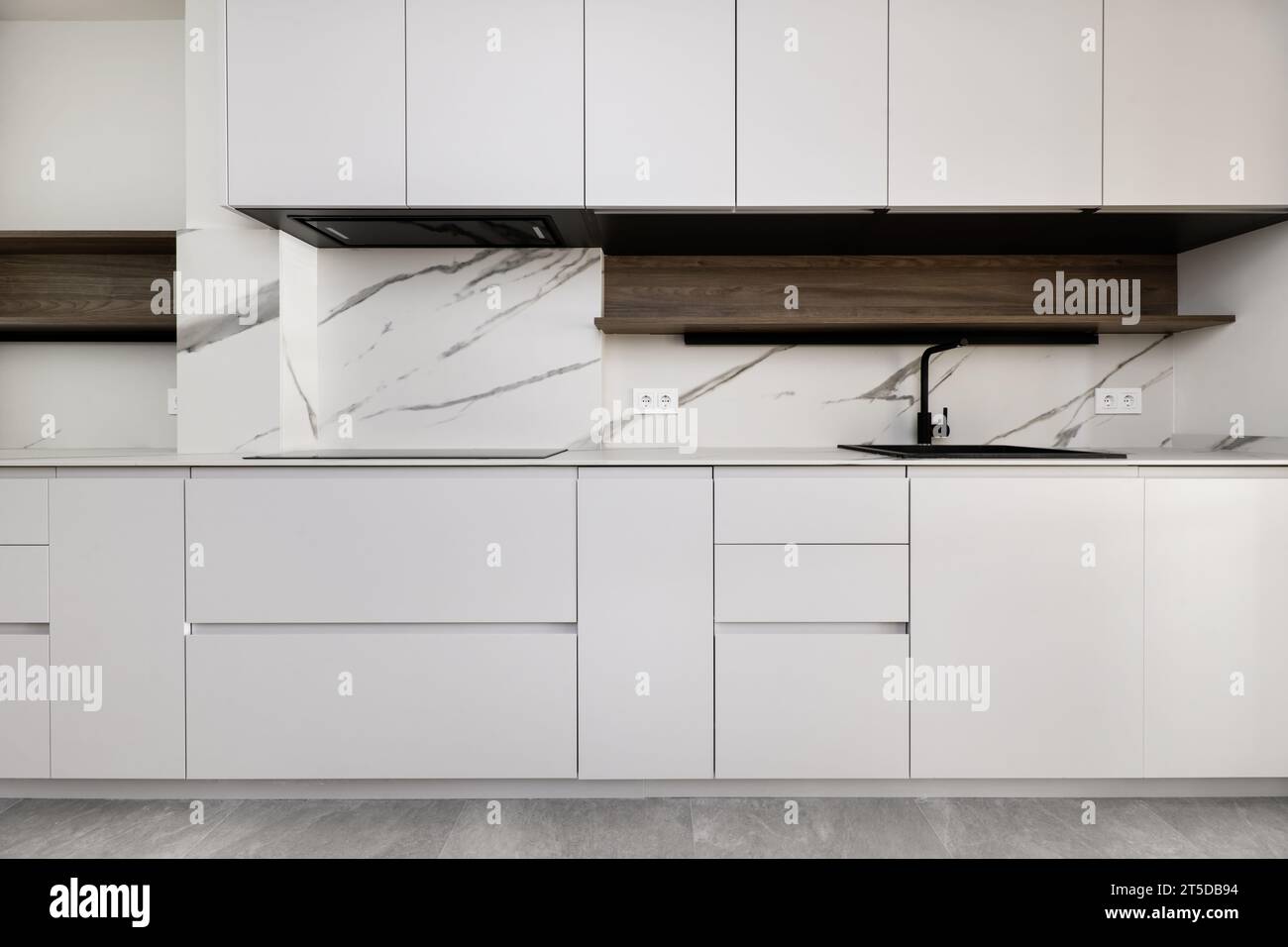 Front image of kitchen with smooth white wooden furniture without white ...