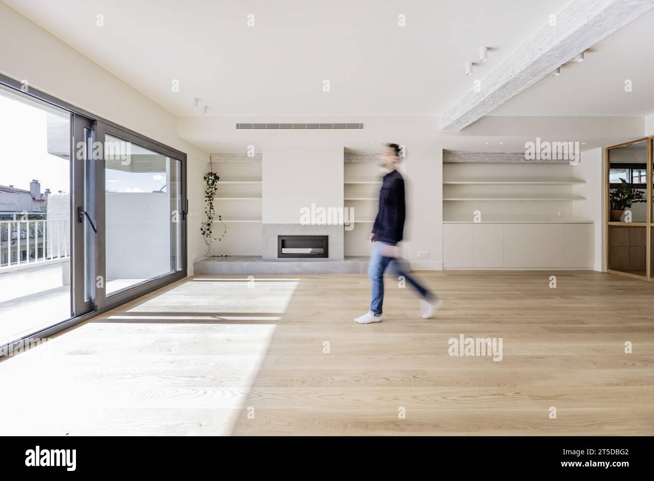 Man walking inside hallway hi-res stock photography and images - Alamy