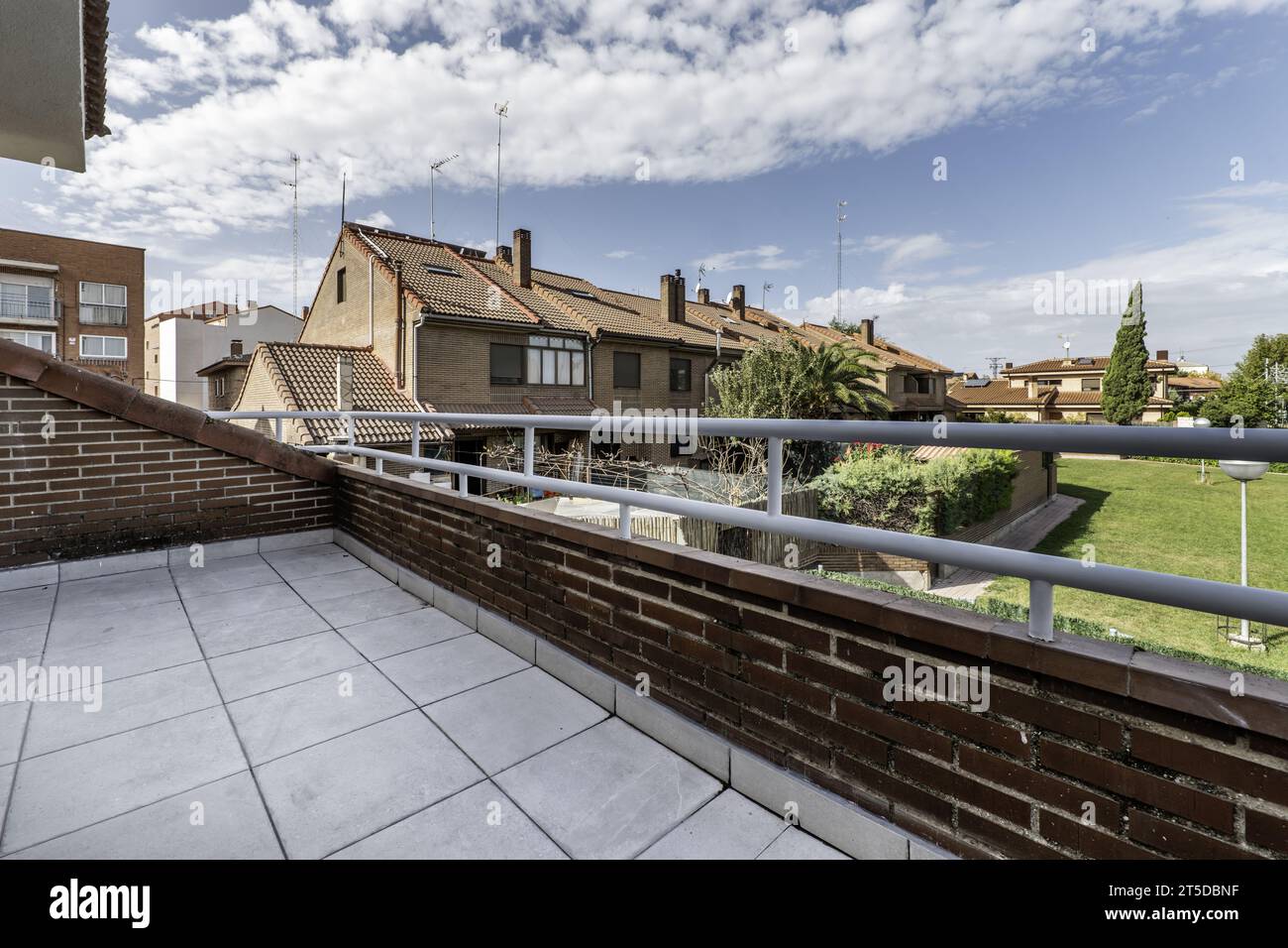 Small terrace with white railing in a single-family home with views of ...