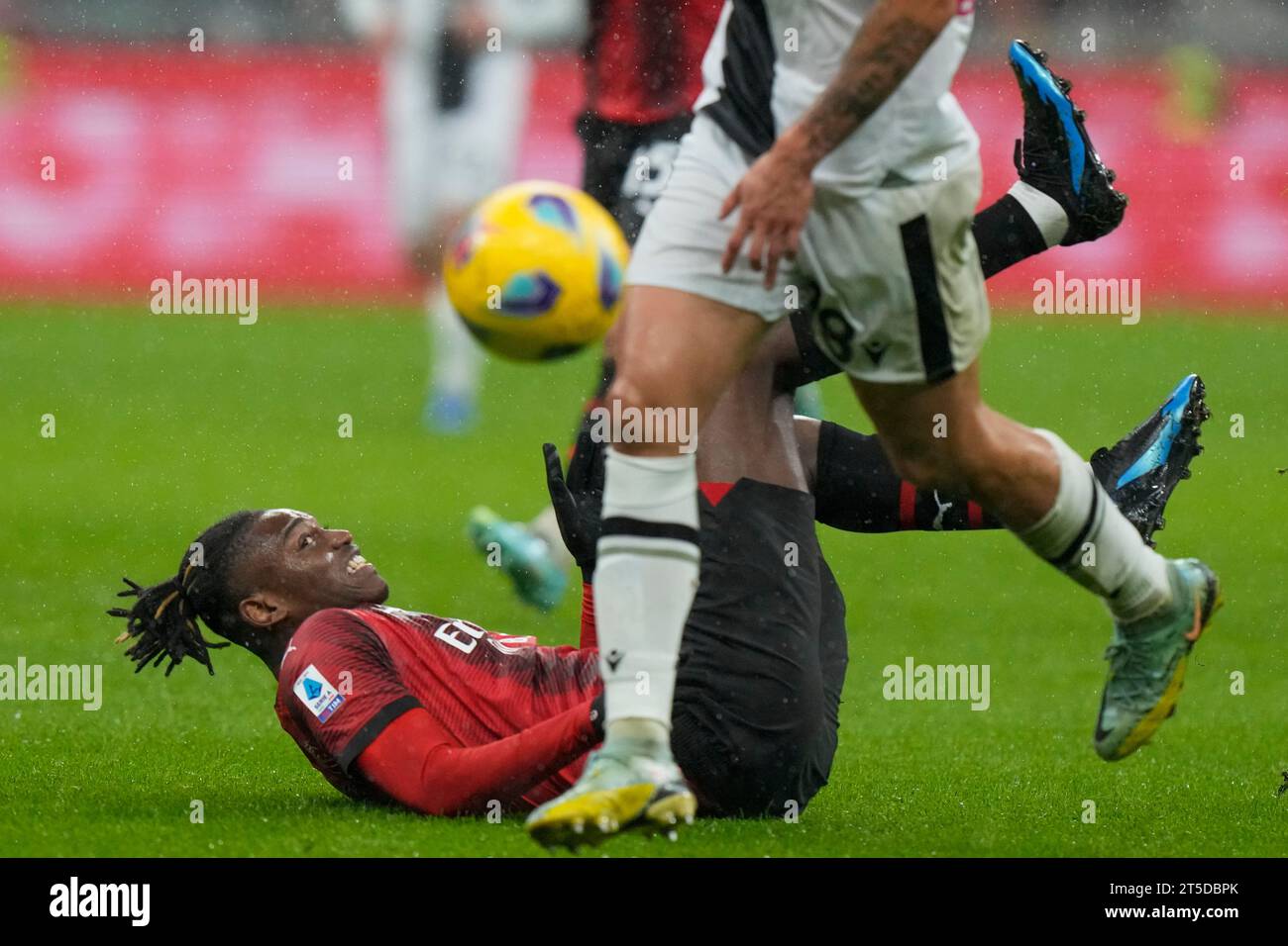 AC Milan's Rafael Leao, left, duels for the ball with Udinese's Nehuen Perez during a Serie A ...