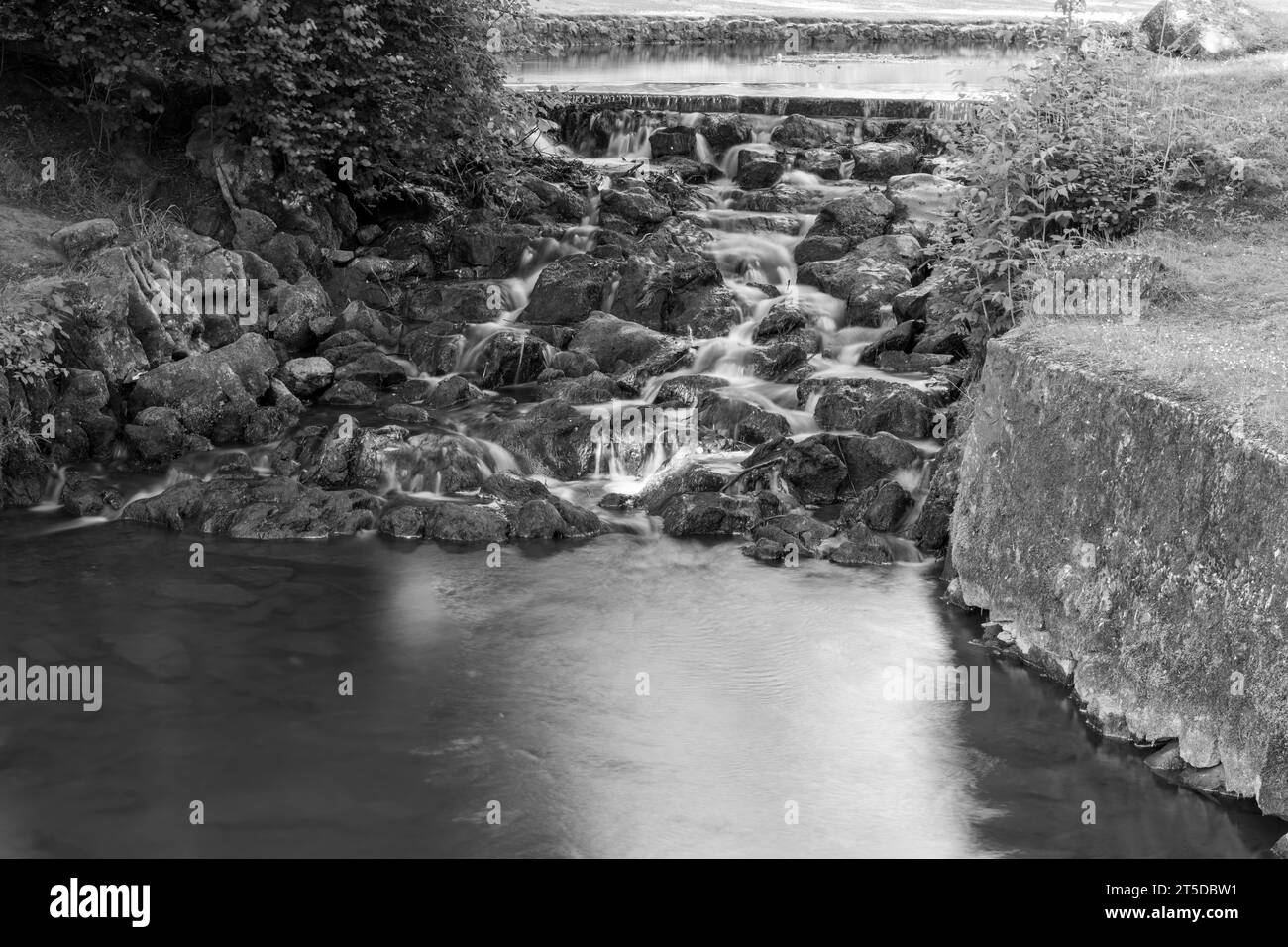 Long exposure of a waterfall flowing through Buxton Pavilion Gardens in ...