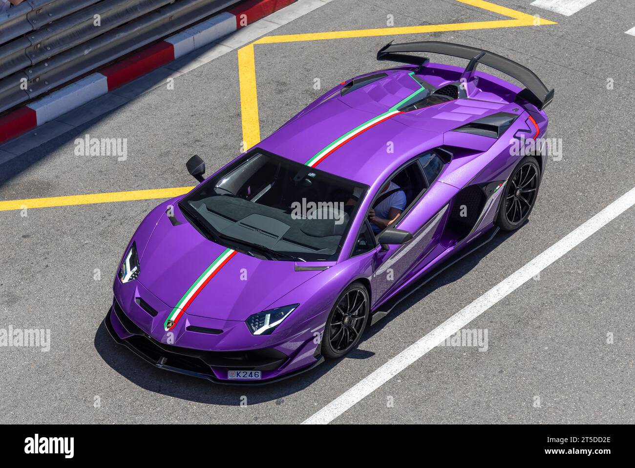 Purple Lamborghini Aventador SVJ driving on the road in the Fairmont ...