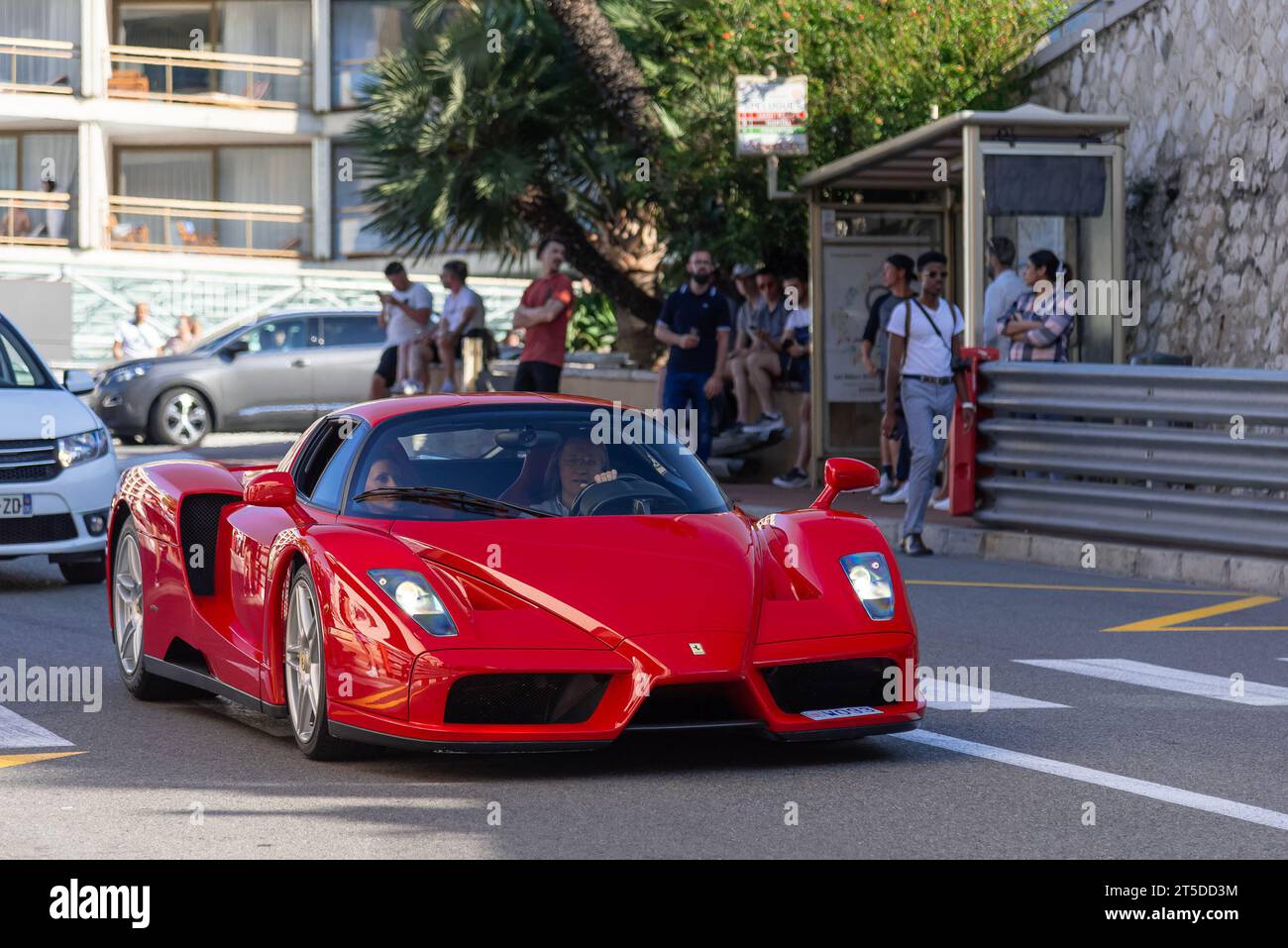 Rosso Corsa Ferrari Enzo driving on the road in the Fairmont Hairpin ...