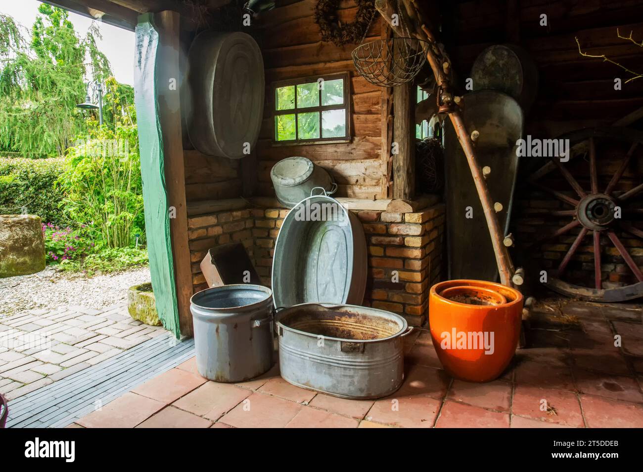Old utensils in an agricultural farm barn wirhmetal tubs and a large ...