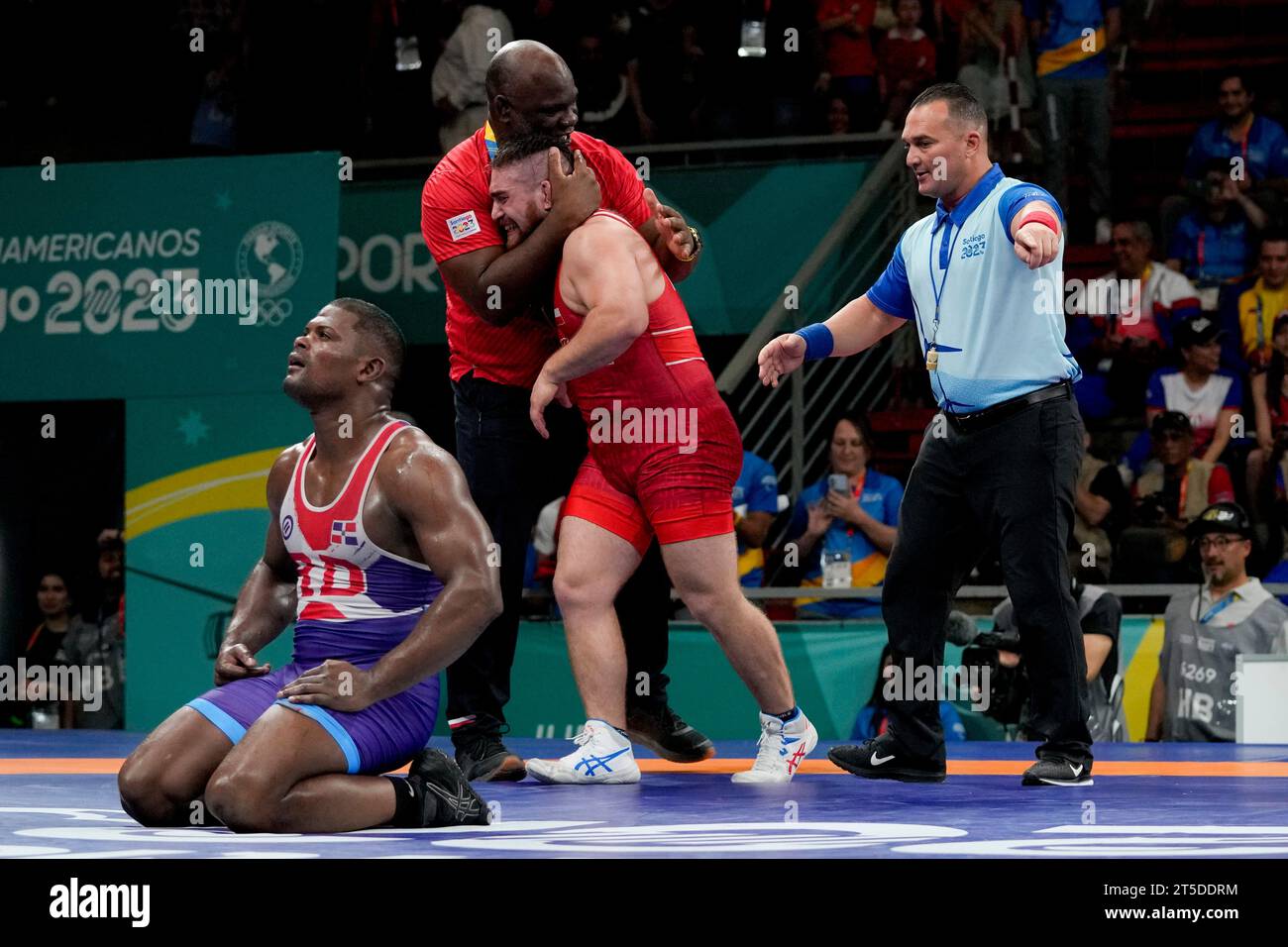 Chile's Jose Moreno, center, is embraced at the end of a men's ...