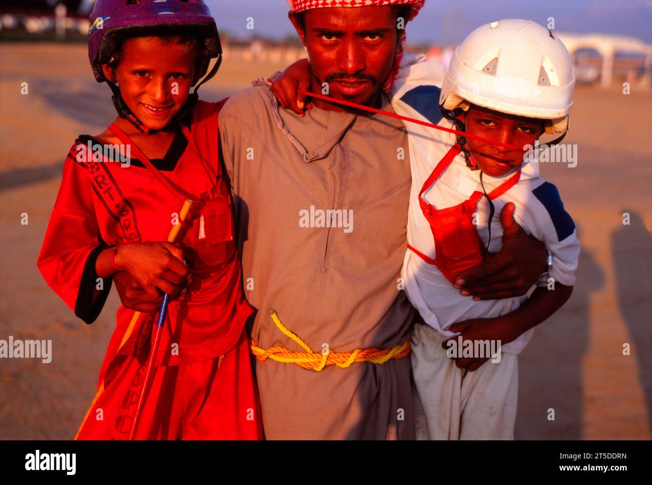A Portrait of Two Child Camel Jockeys Moments After Finishing A Race ...