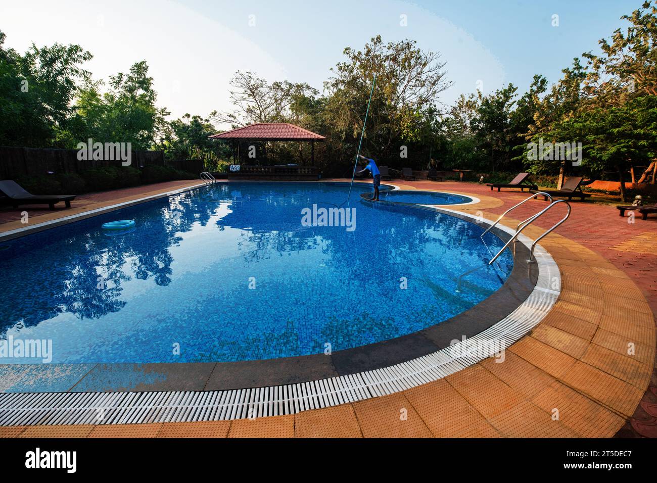 Park and open typical swimmimng pool in hotel in Goa in southern India ...