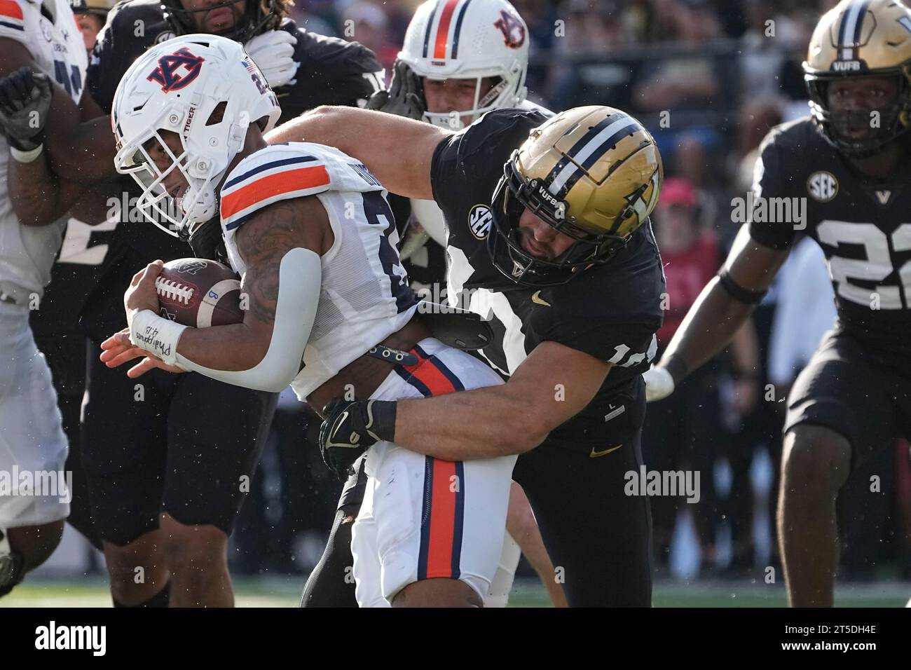 Auburn running back Jarquez Hunter, left, is tackled by Vanderbilt ...