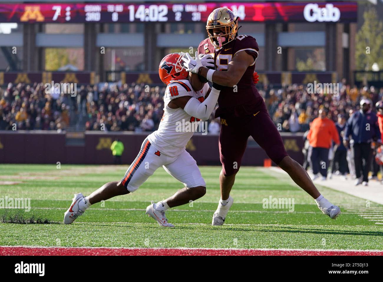 Minnesota tight end Brevyn Spann-Ford, right, runs with the ball to ...