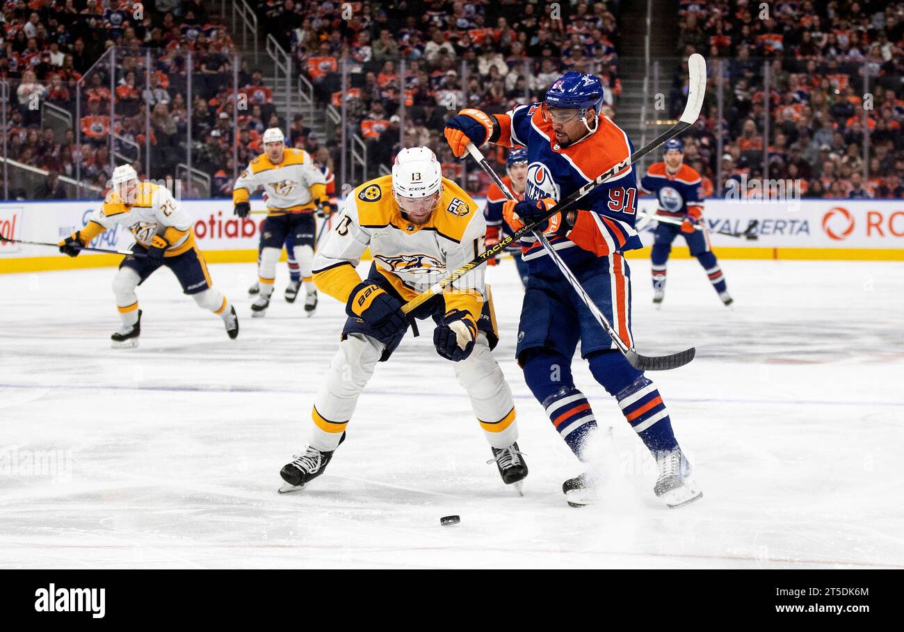 Nashville Predators' Yakov Trenin (13) and Edmonton Oilers' Evander ...