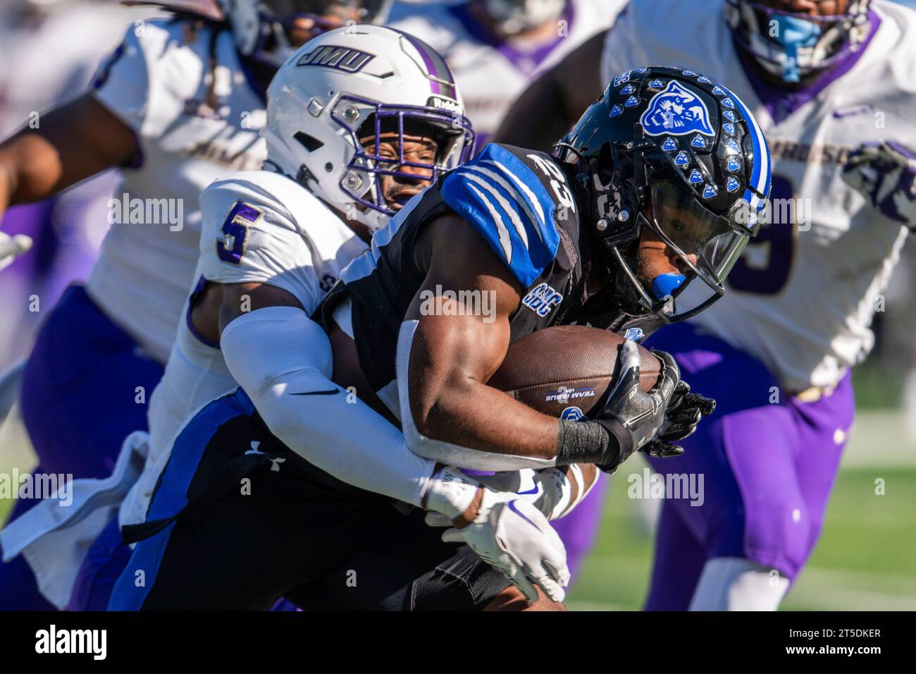 Georgia State running back Marcus Carroll, front right, is tackled by ...