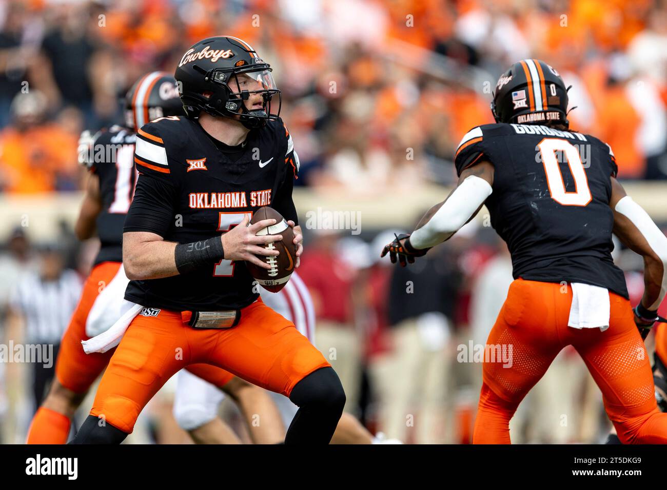 Oklahoma State quarterback Alan Bowman (7) drops back to pass the ball ...