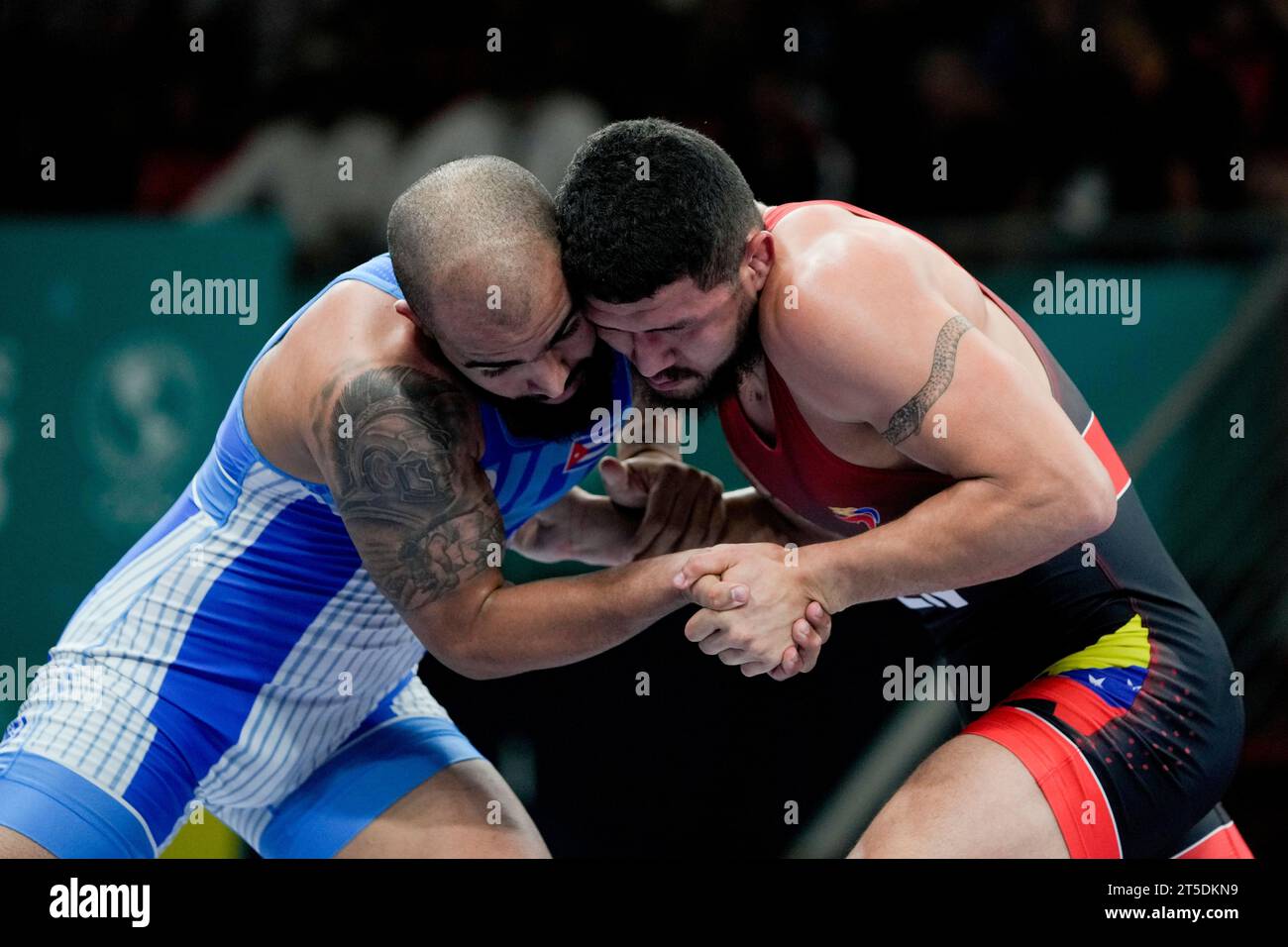 Cuba's Daniel Gregorich, left, and Venezuela's Luis Avendano compete ...
