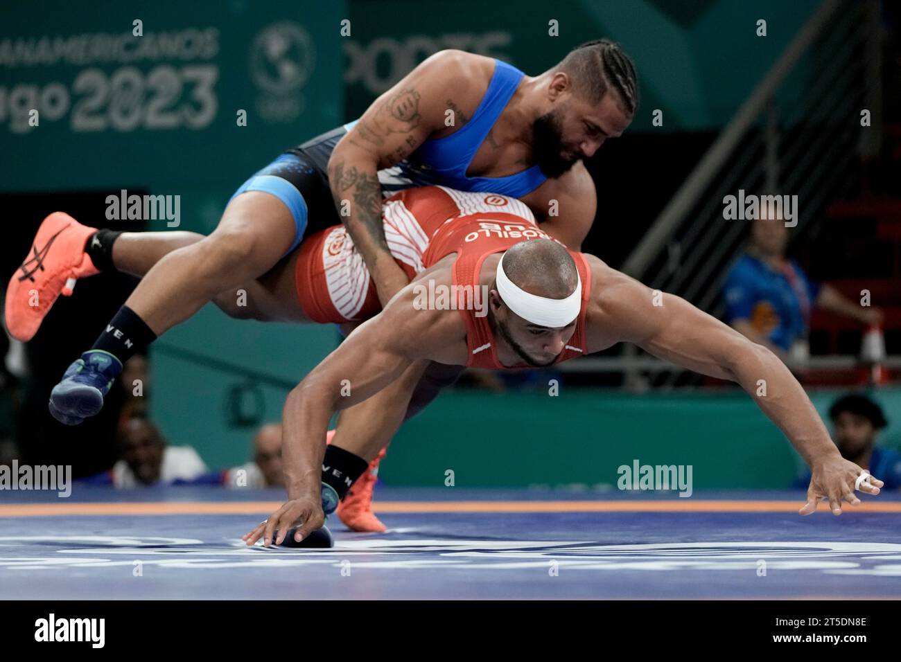 Venezuela's Moises Perez takes down Cuba's Gabriel Rosillo during the ...